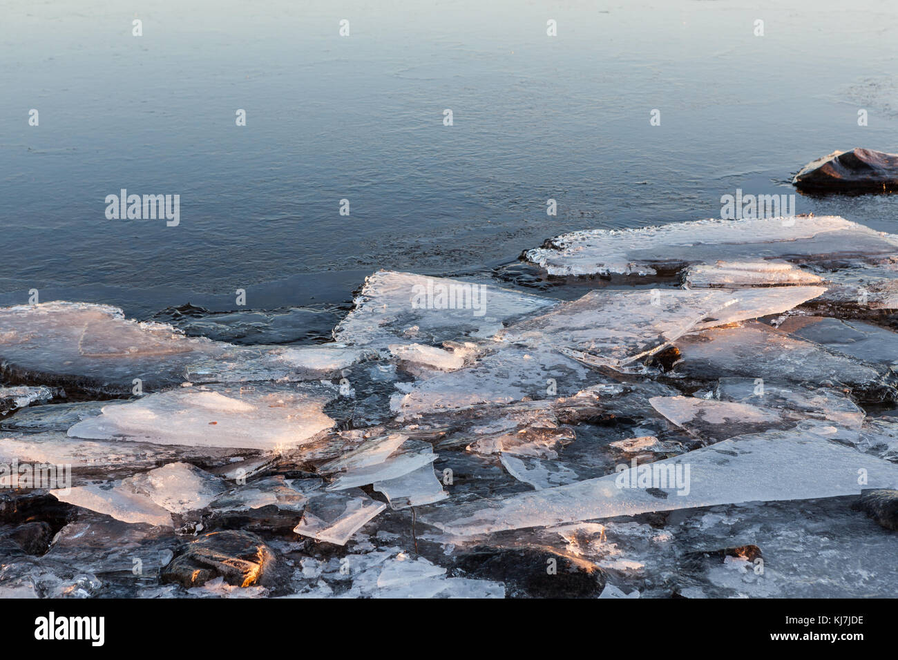 Ice pieces on lake shore Stock Photo - Alamy