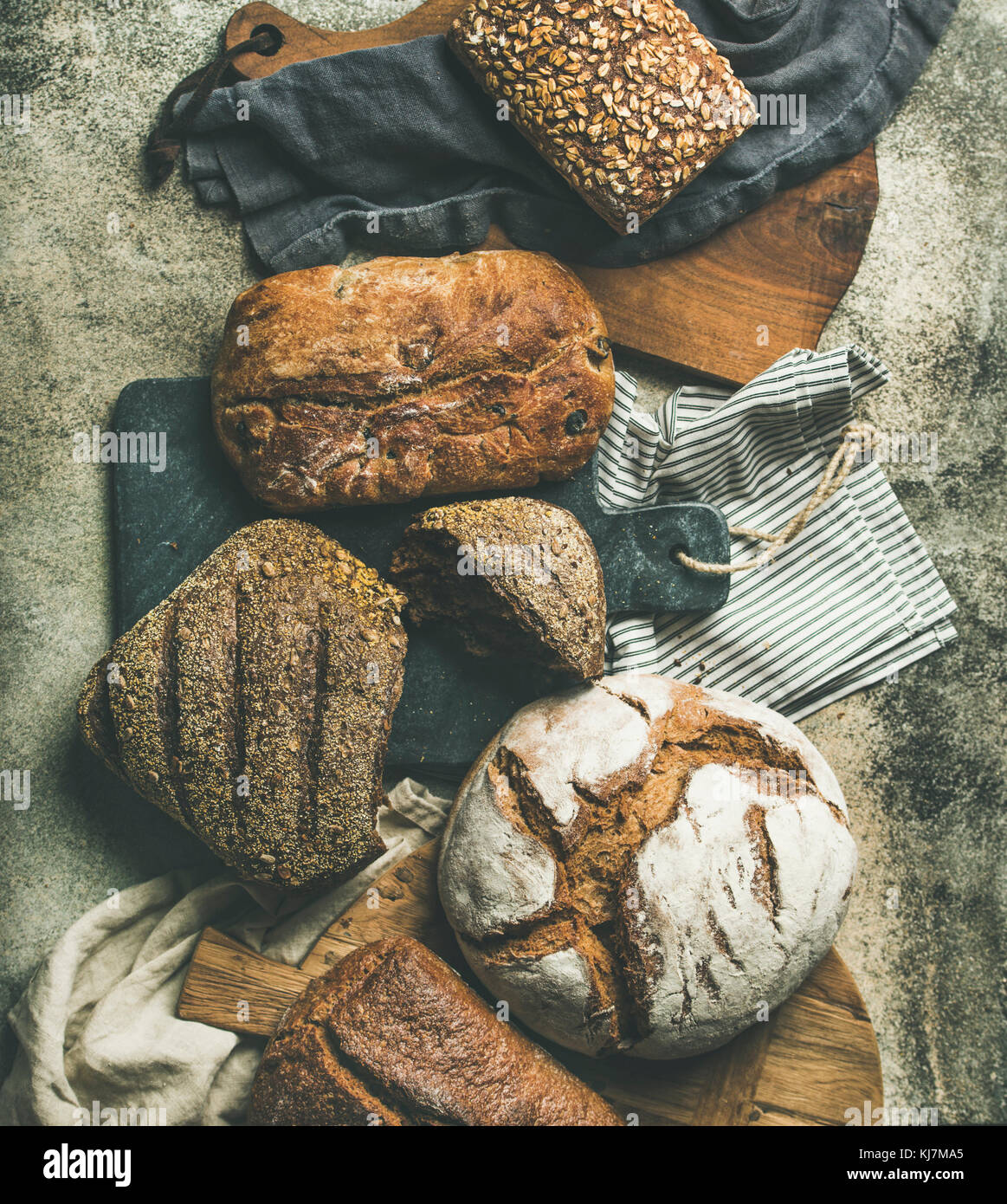 Flat-lay of various bread selection. Rye, wheat and multigrain rustic ...