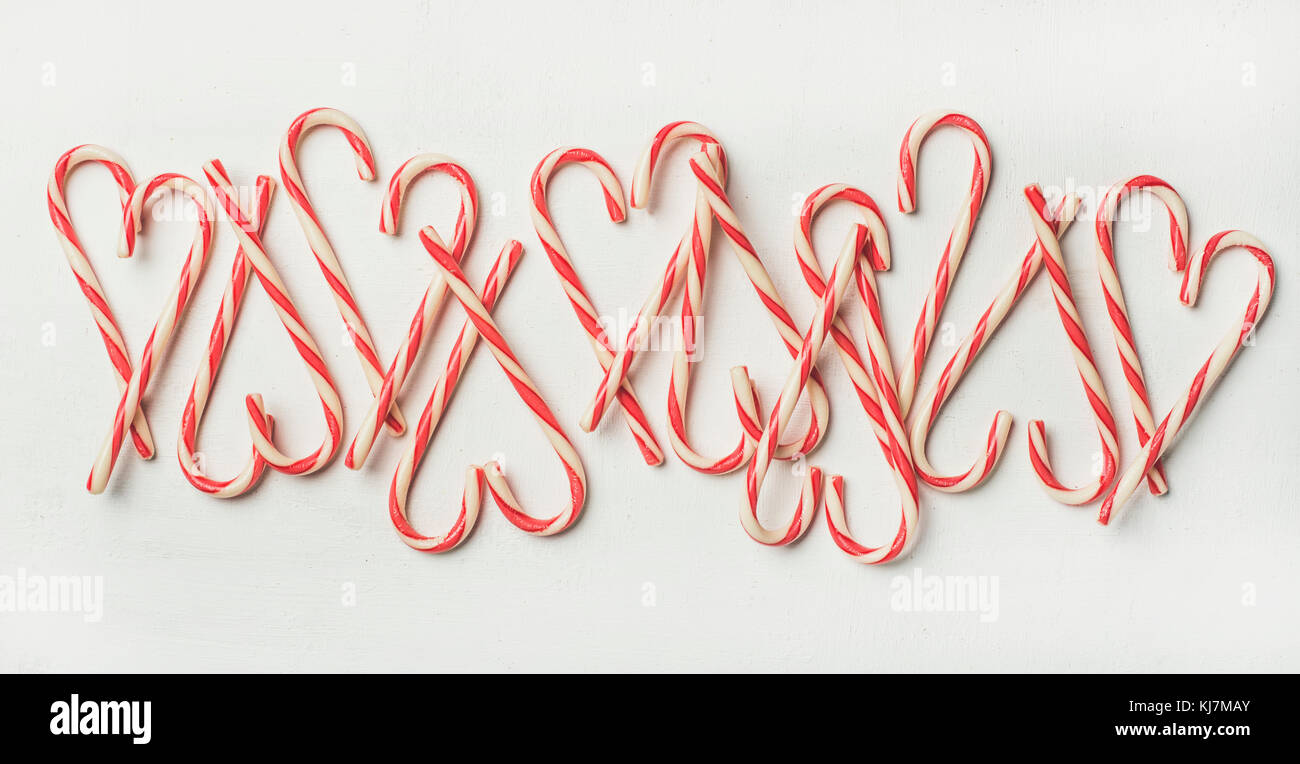 Christmas holiday red candy cane pattern, texture and background on white background, flat-lay ...