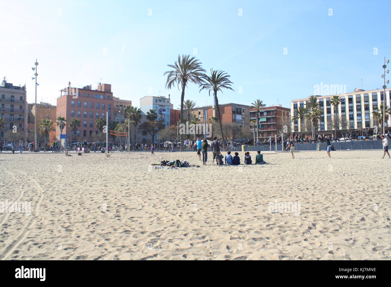 The city of Barcelona, Spain from the sandy beach in spring, sunny ...