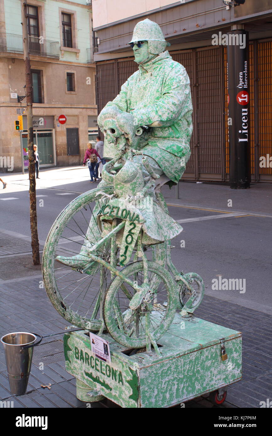 A green street costume artist beggar in Barcelona, Spain Stock Photo ...