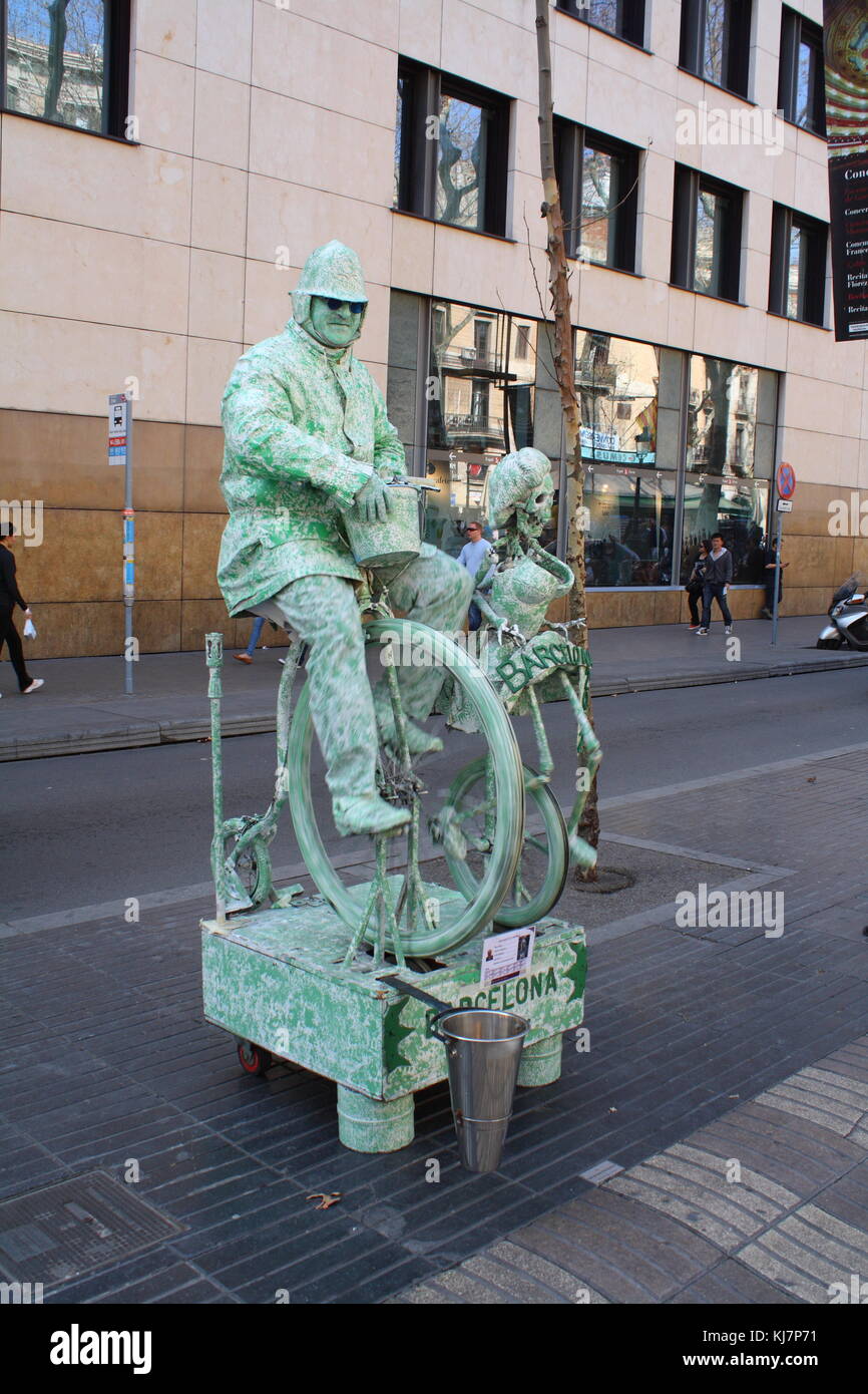 A green street costume artist beggar in Barcelona, Spain Stock Photo ...