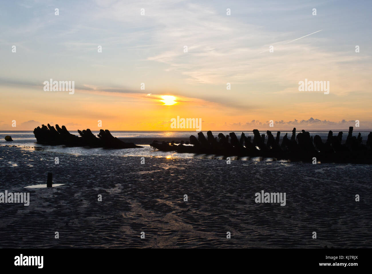 Sunset picture of the exposed wreck of the wooden Norwegian barque SS ...