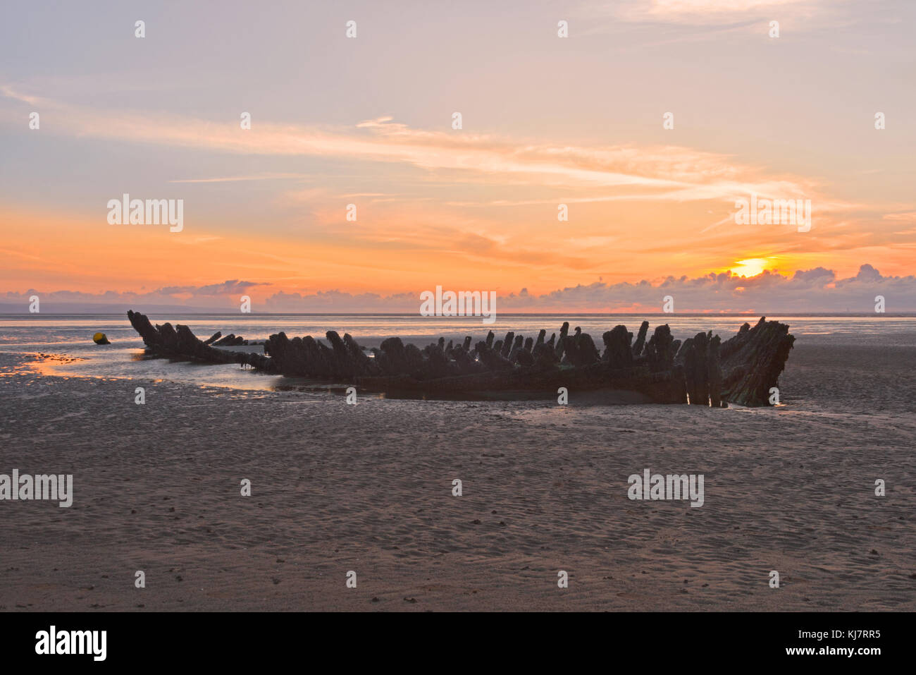 Sunset picture of the exposed wreck of the wooden Norwegian barque SS ...