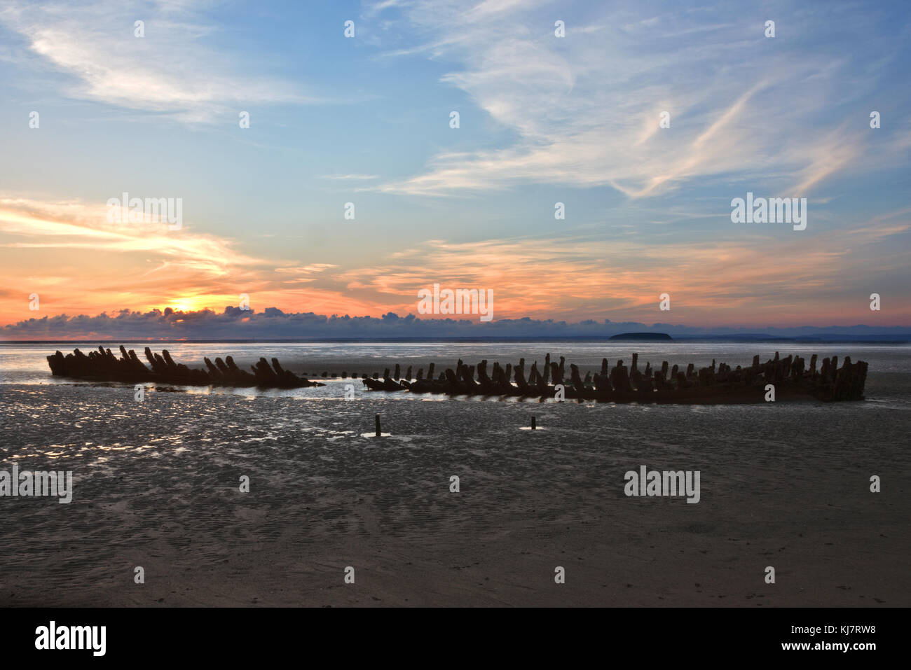 Sunset picture of the exposed wreck of the wooden Norwegian barque SS ...