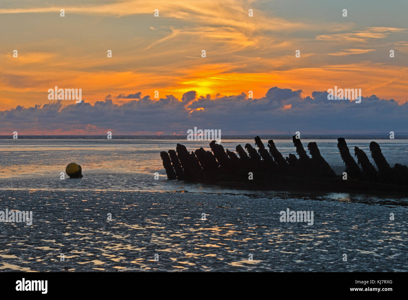 Sunset picture of the exposed wreck of the wooden Norwegian barque SS ...