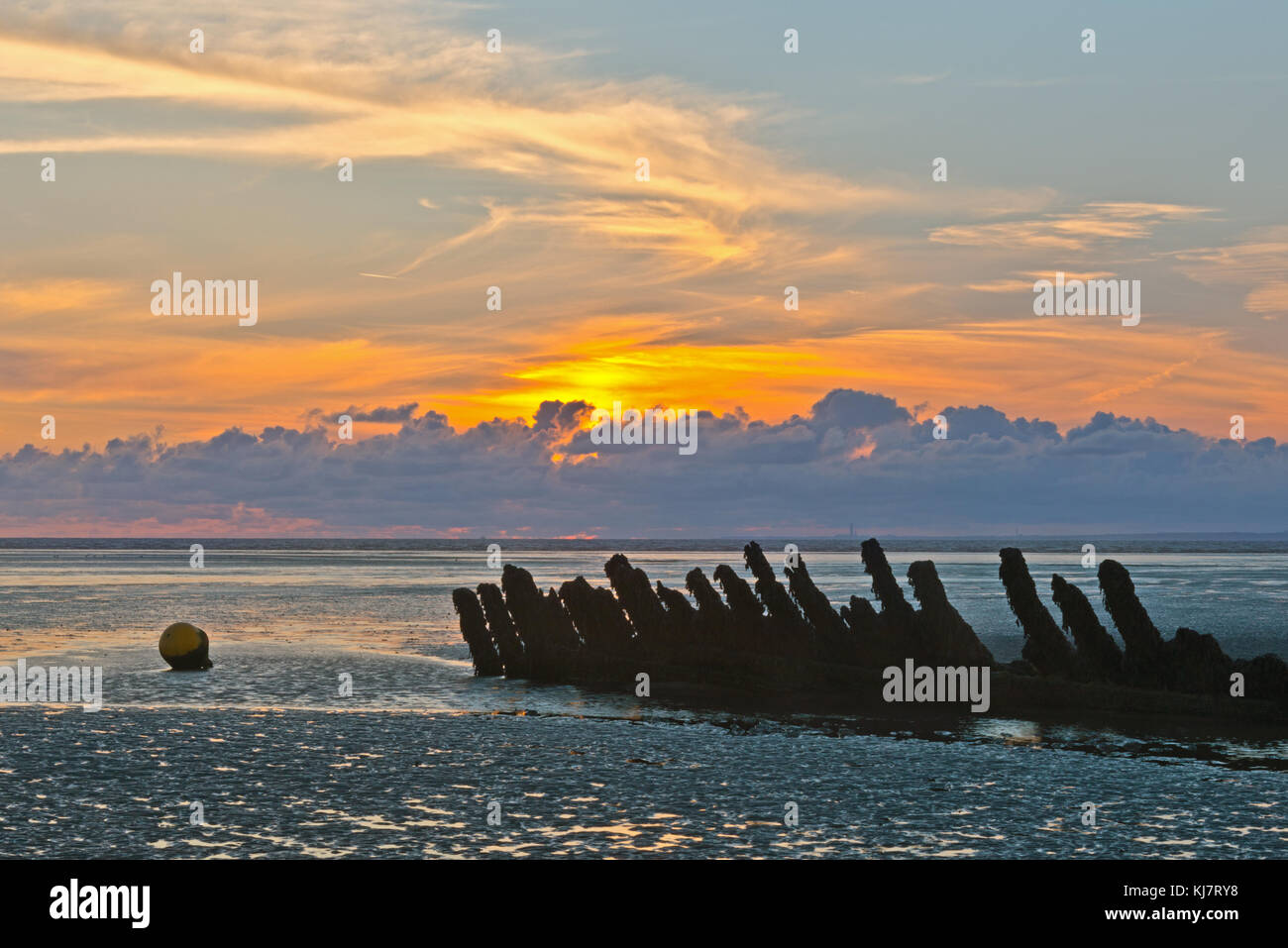 Sunset picture of the exposed wreck of the wooden Norwegian barque SS ...