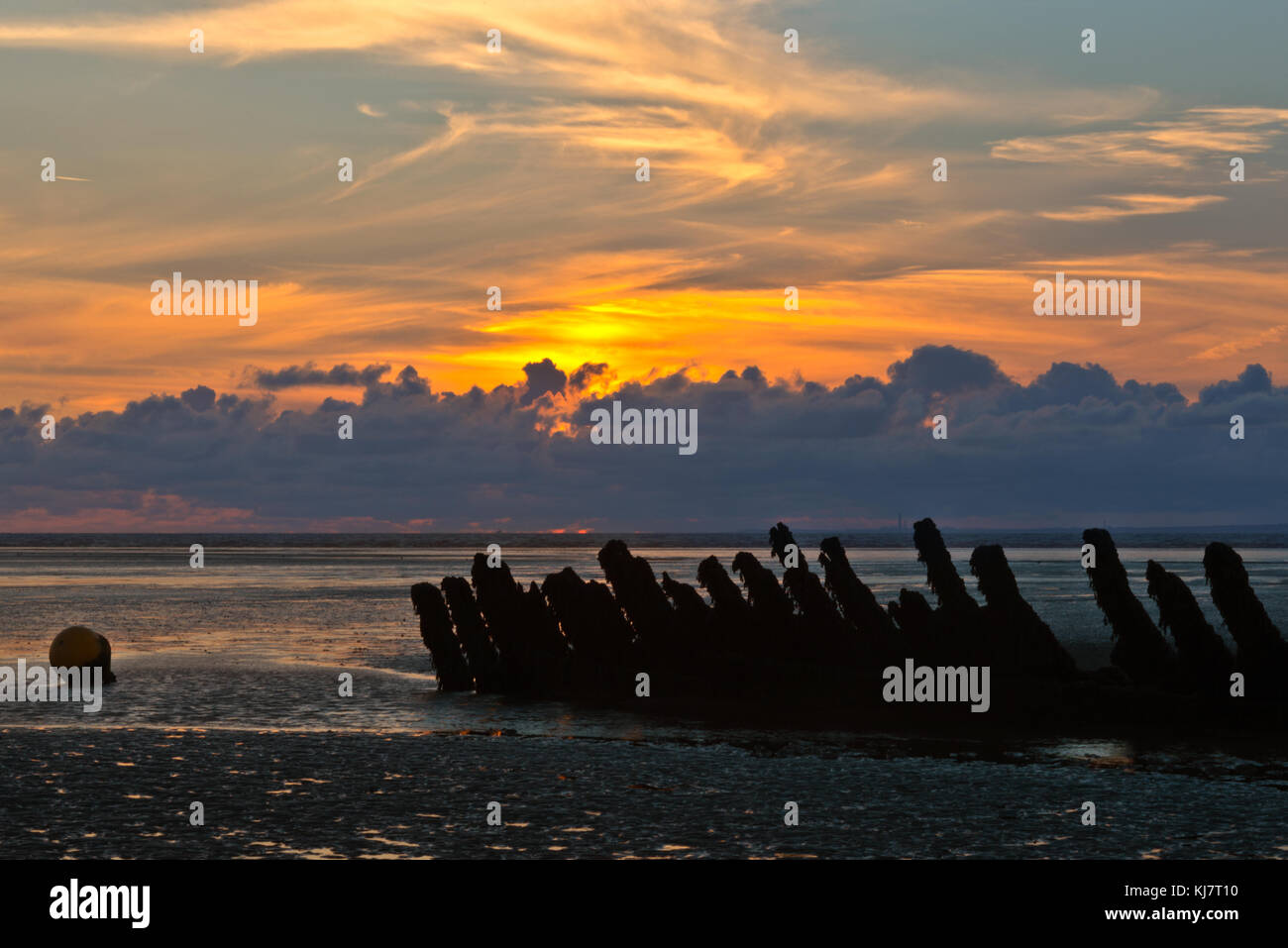 Sunset picture of the exposed wreck of the wooden Norwegian barque SS ...
