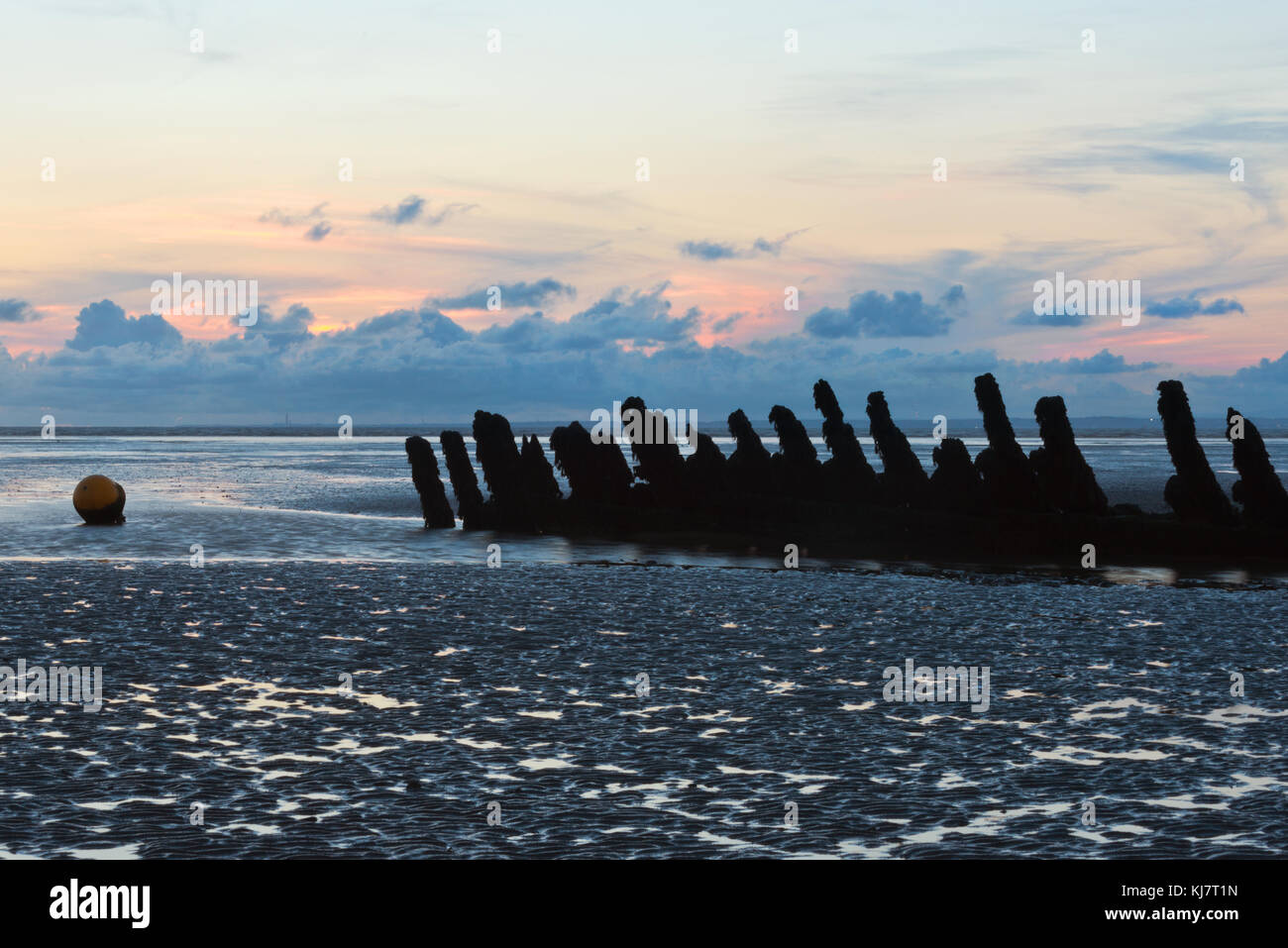 Sunset picture of the exposed wreck of the wooden Norwegian barque SS ...