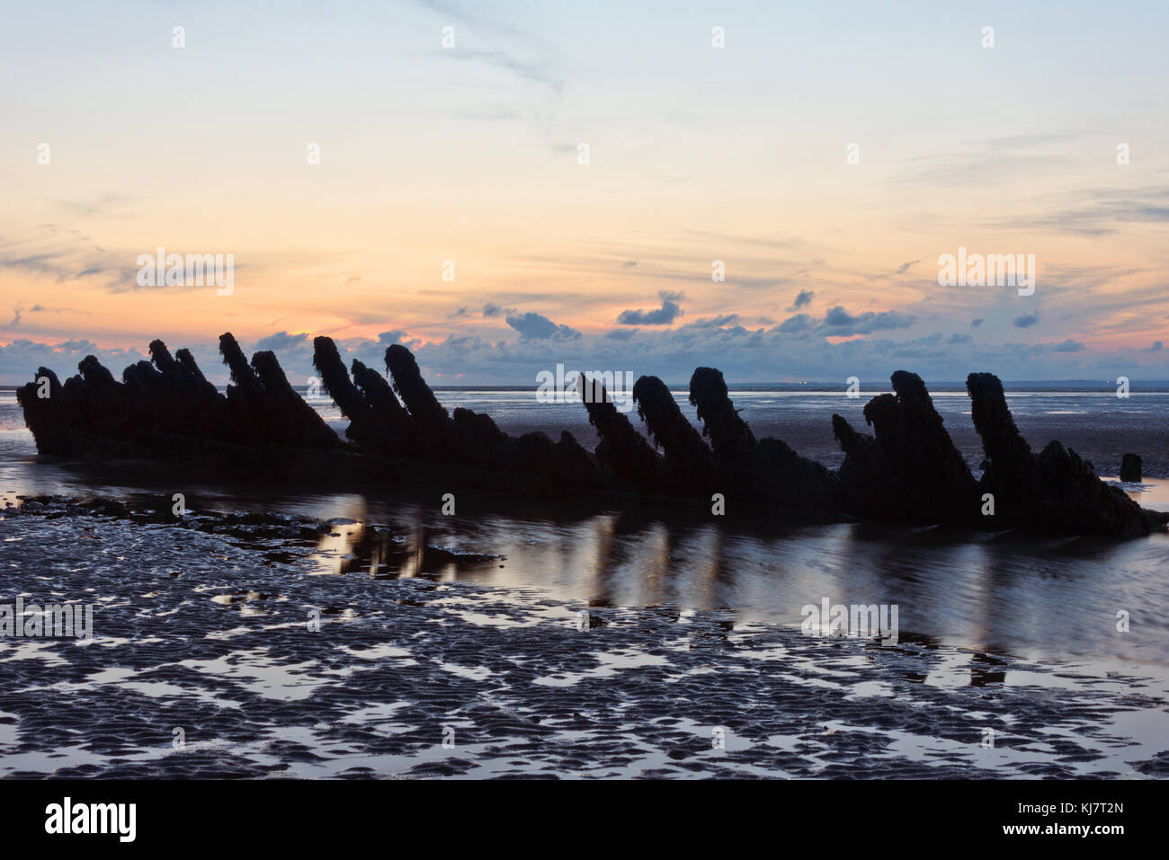 Sunset picture of the exposed wreck of the wooden Norwegian barque SS ...