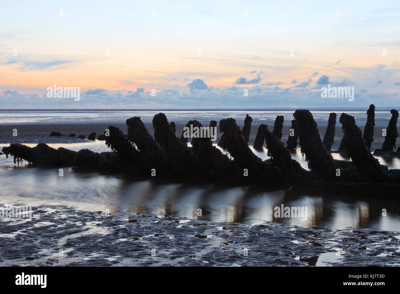 Sunset picture of the exposed wreck of the wooden Norwegian barque SS ...