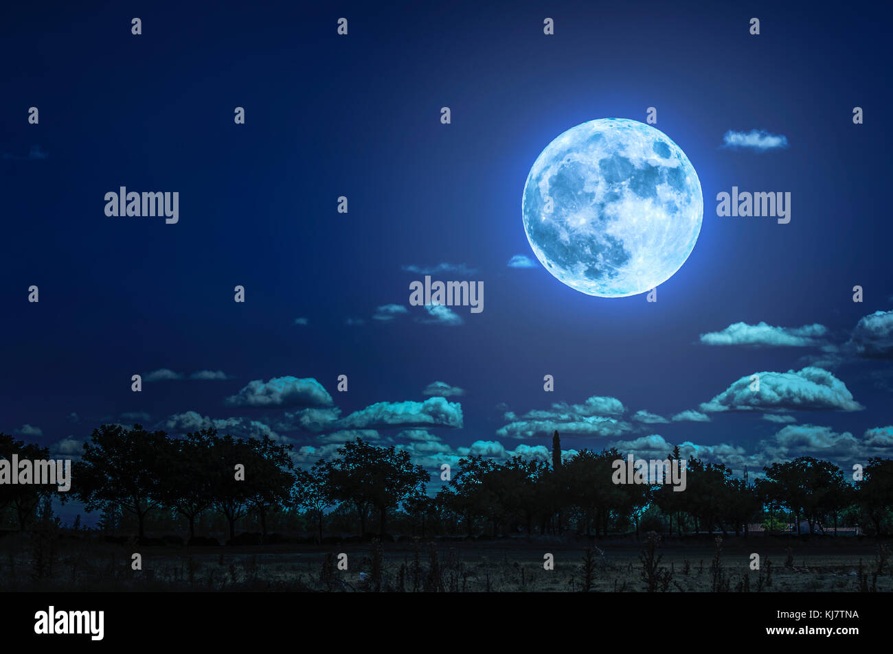 Cloudy sky and moon in the night. Moonlight over city Stock Photo - Alamy
