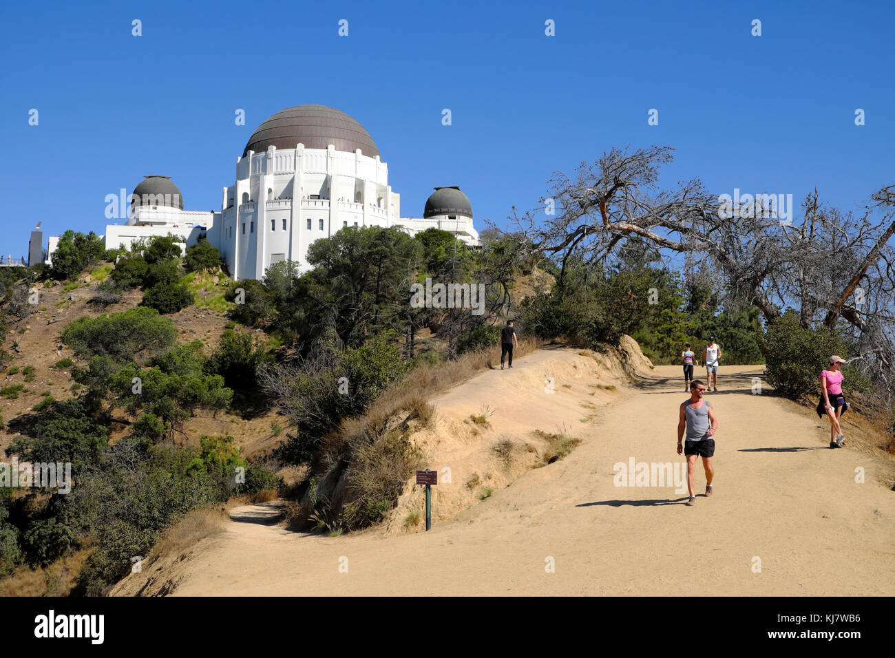 Visitors walking along the trail on path and view of Griffith ...