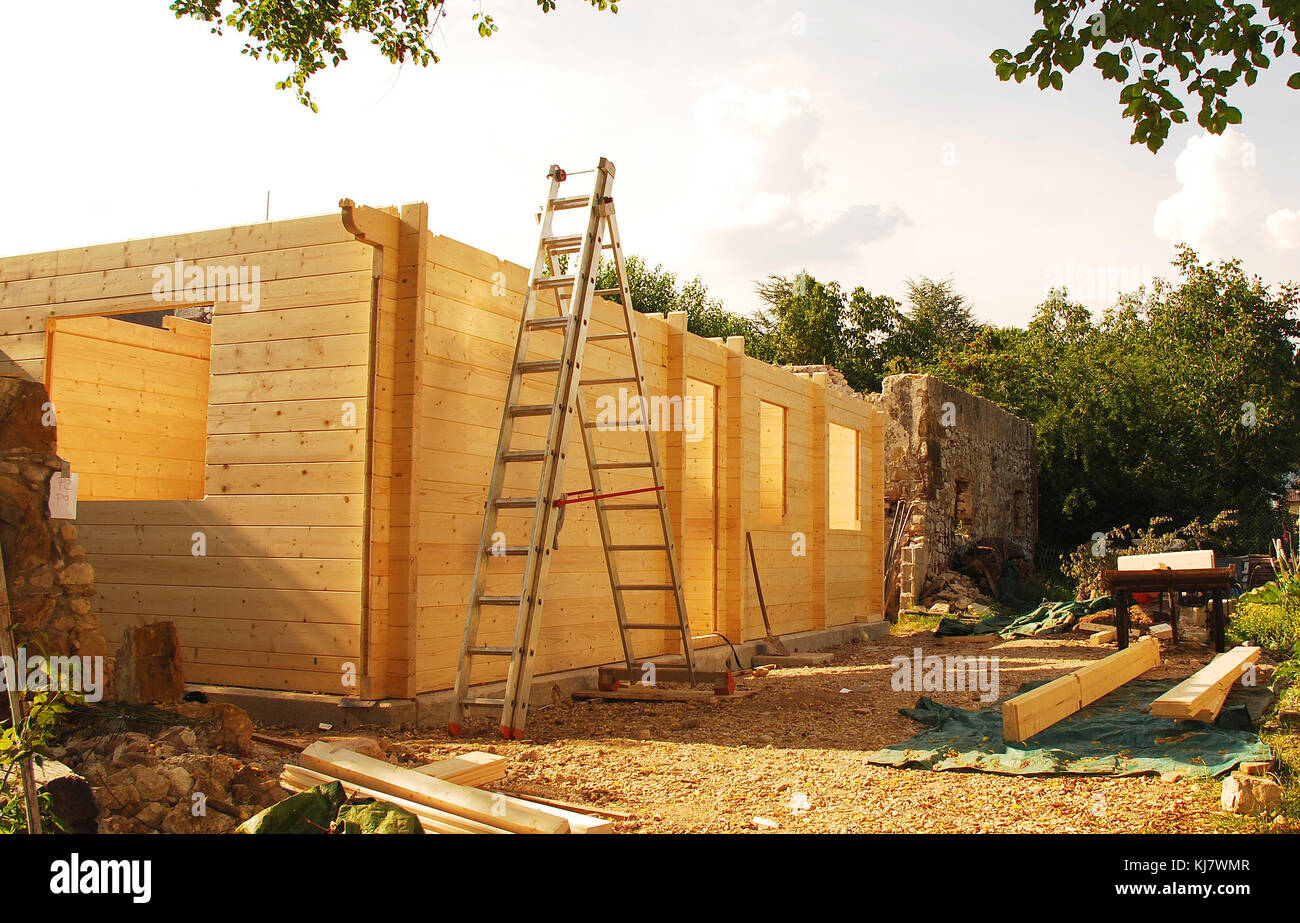 A partially constructed wood (fir) prefabricated block house on a ...