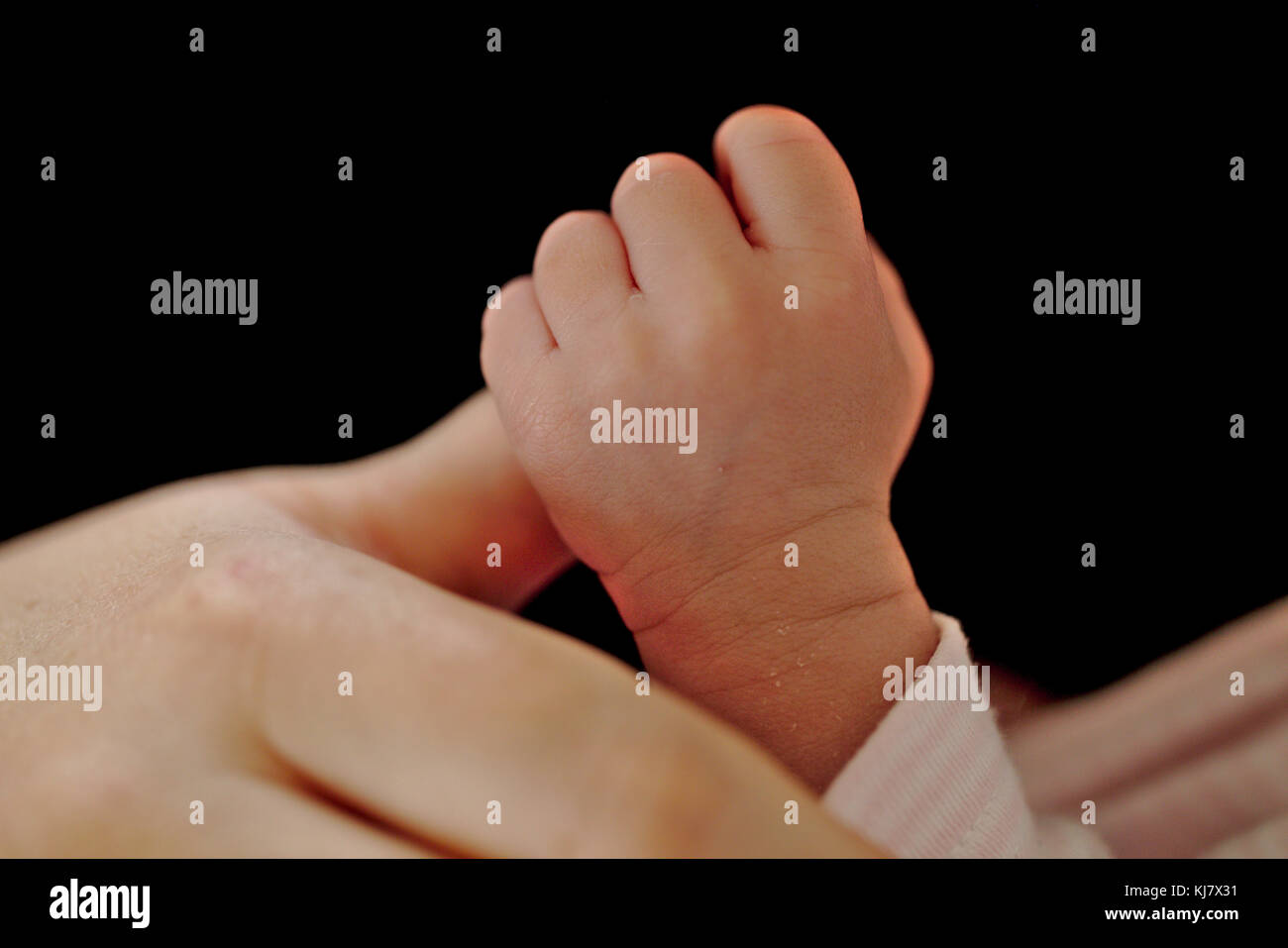 Baby hand holding mothers finger hi-res stock photography and images ...