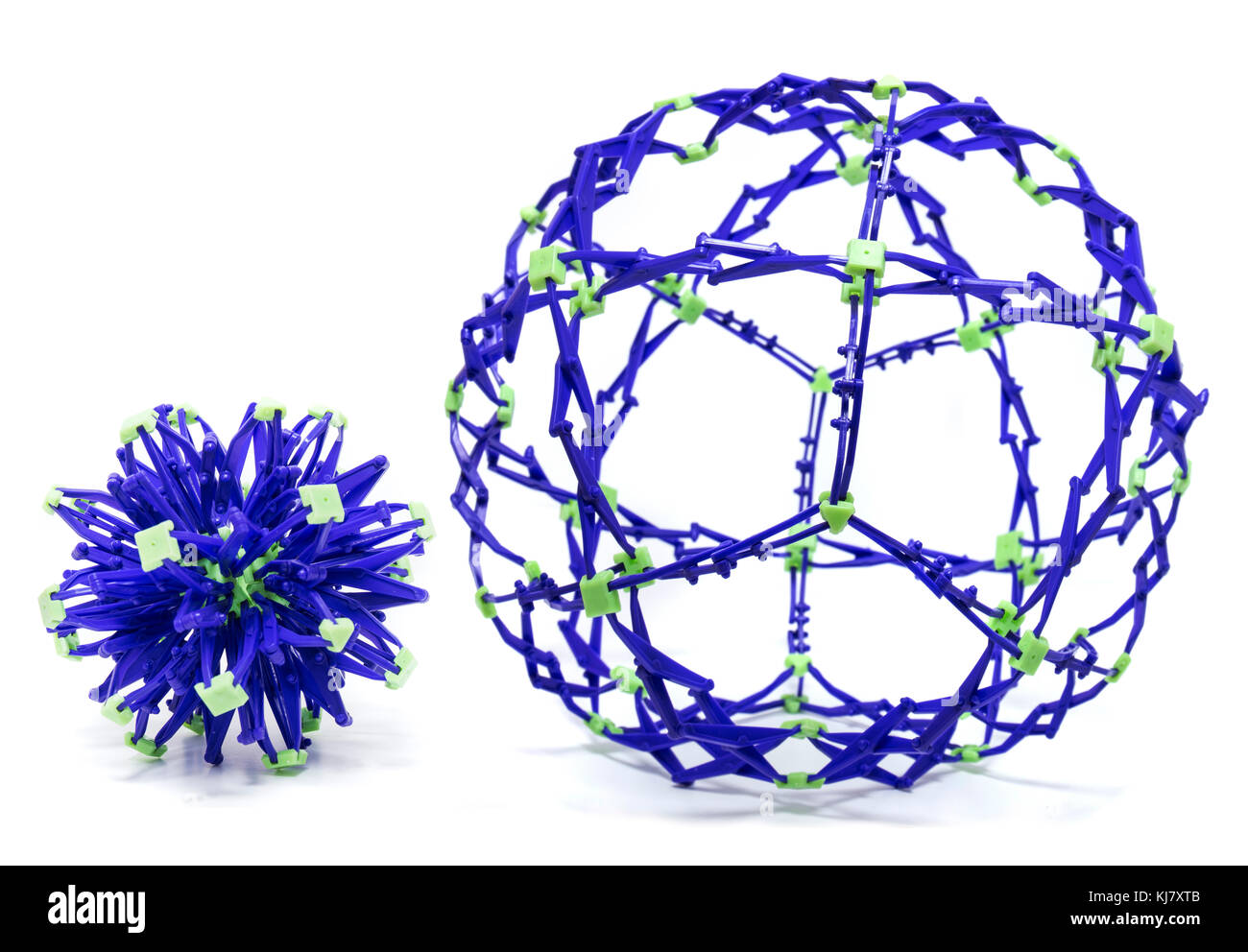 Collapsible purple and green color sphere isolated on a white ...