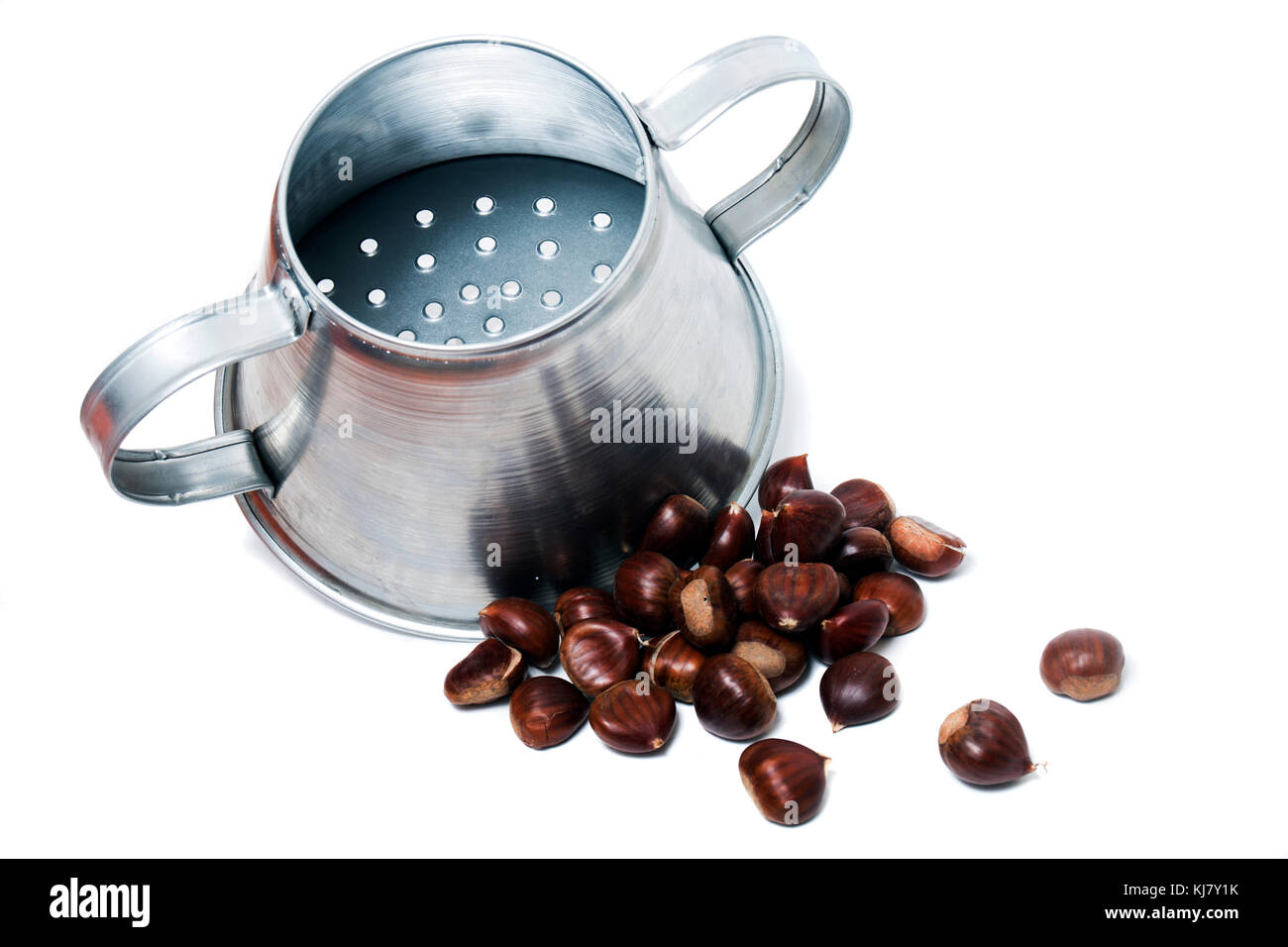Close view of a metal rustic chestnut roaster isolated on a white ...