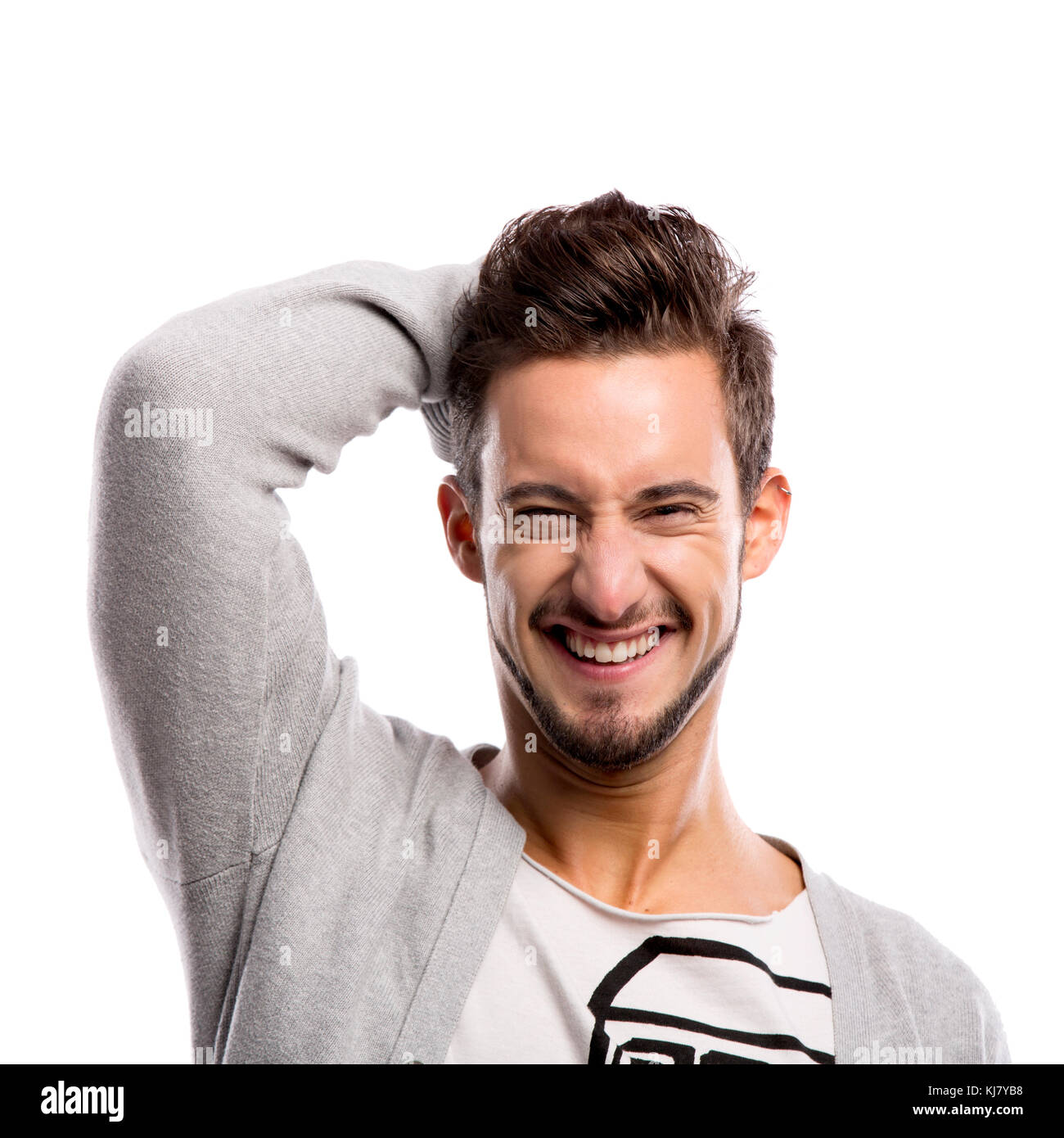 Casual portrait of a young man laughing isolated over a white ...
