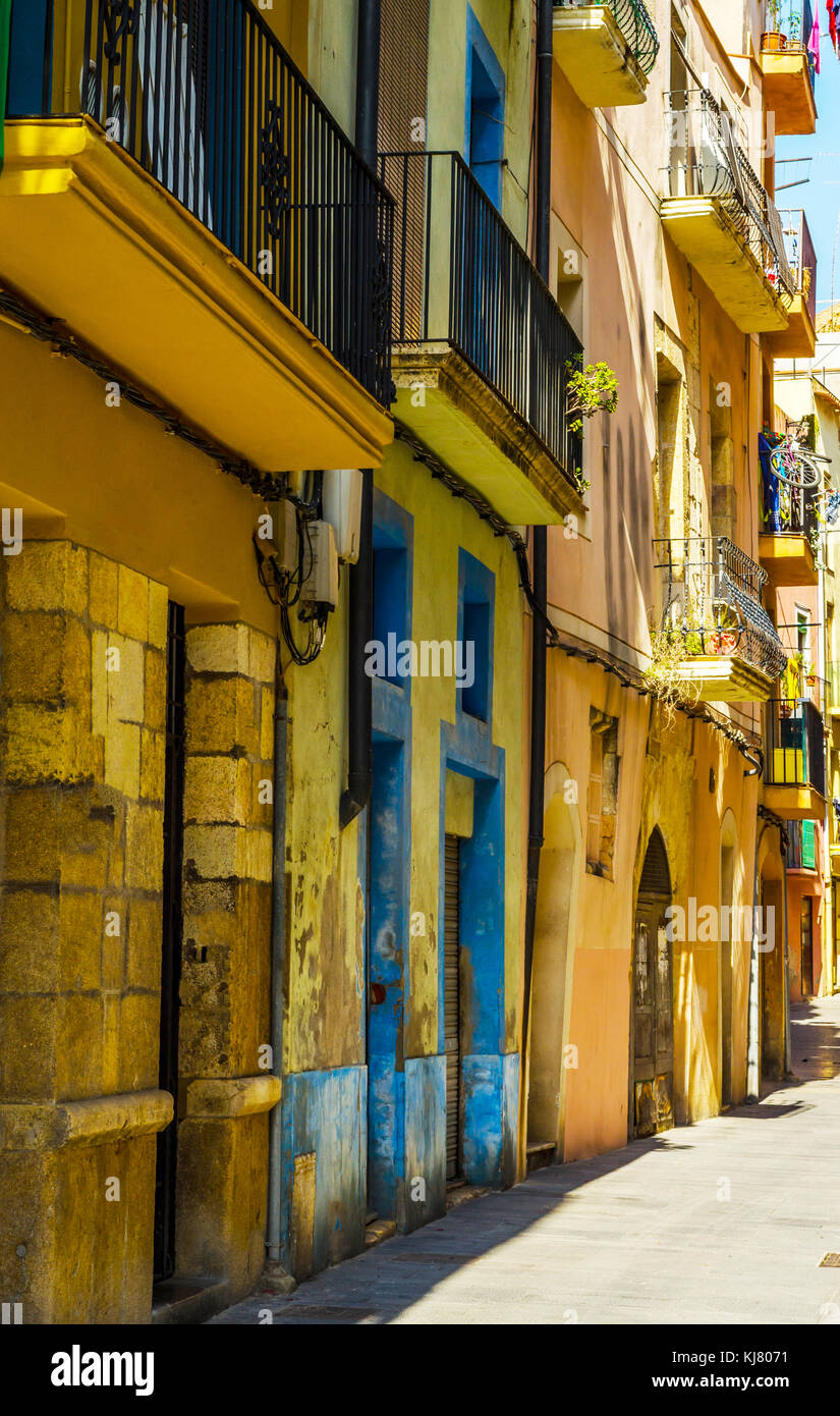 charming narrow street, street with colorful facades of buildings ...