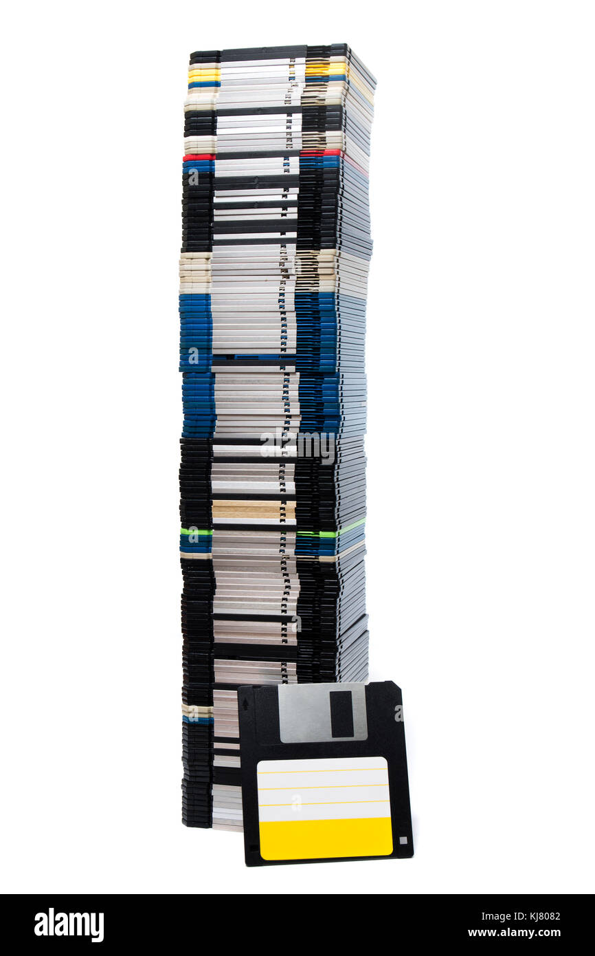 Vertical pile of computer floppy disks isolated on a white background ...
