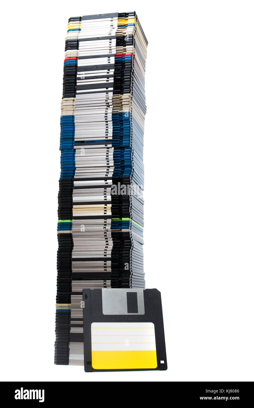 Vertical pile of computer floppy disks isolated on a white background ...