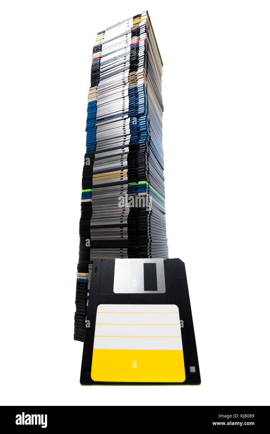Vertical pile of computer floppy disks isolated on a white background ...