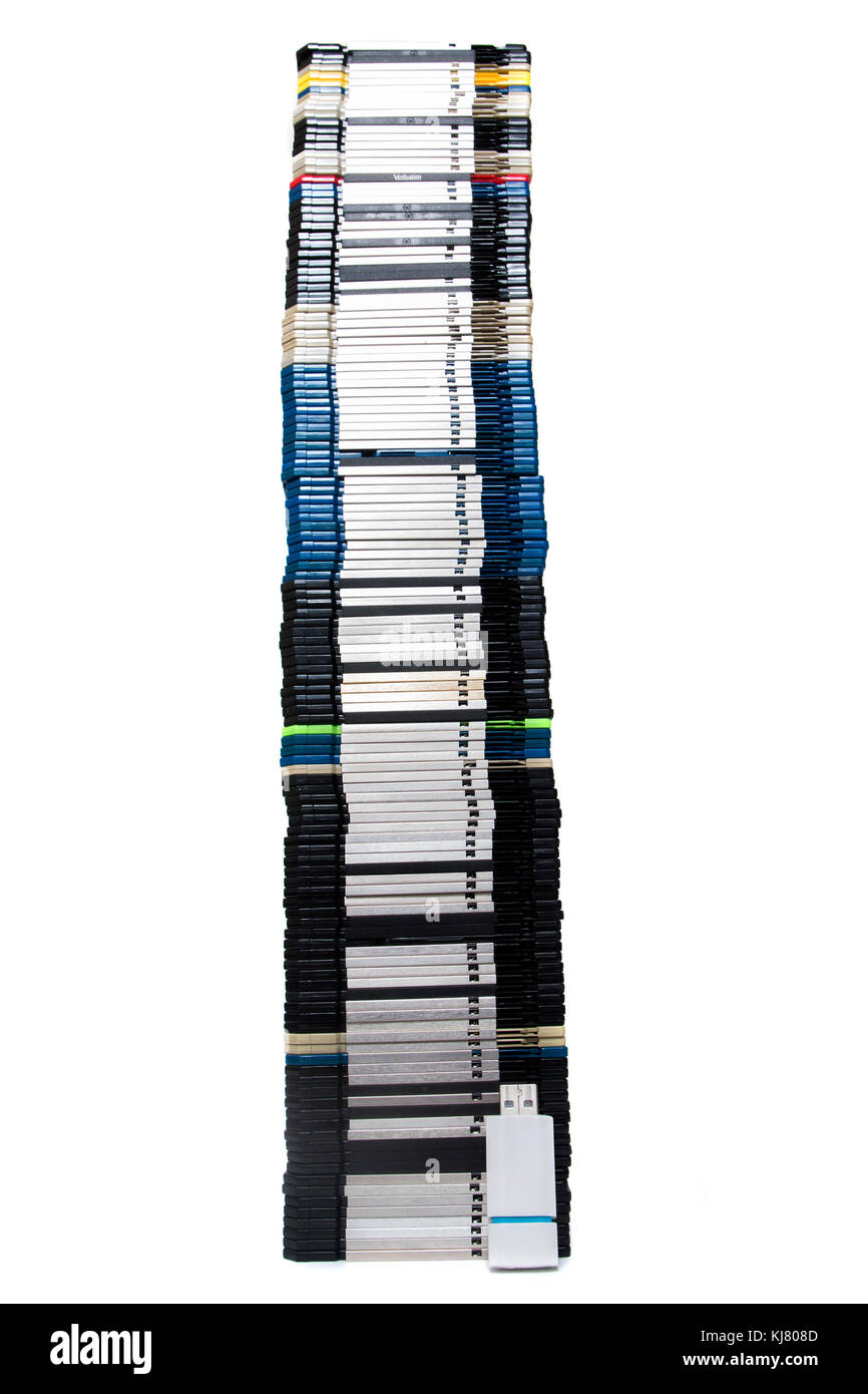 Vertical pile of computer floppy disks with usb disk isolated on a ...