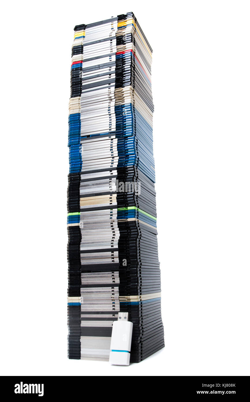 Vertical pile of computer floppy disks with usb disk isolated on a ...