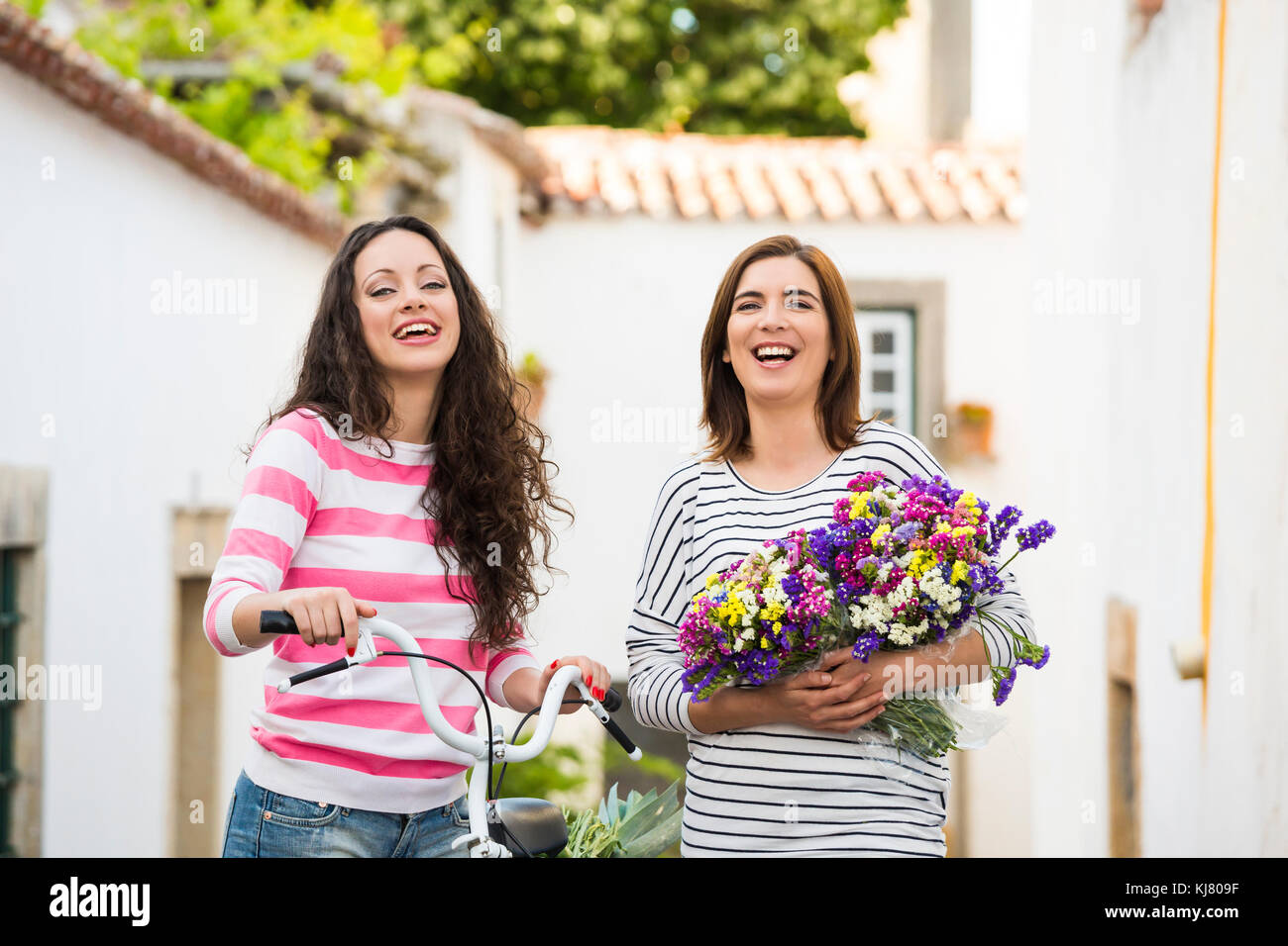 Two beautiful and happy friends smiling Stock Photo - Alamy