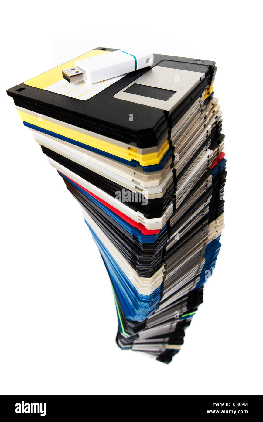 Vertical pile of computer floppy disks with usb disk isolated on a ...