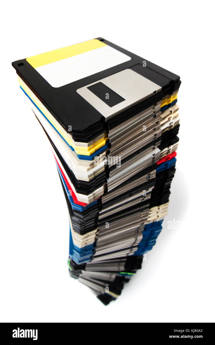 Vertical pile of computer floppy disks isolated on a white background ...