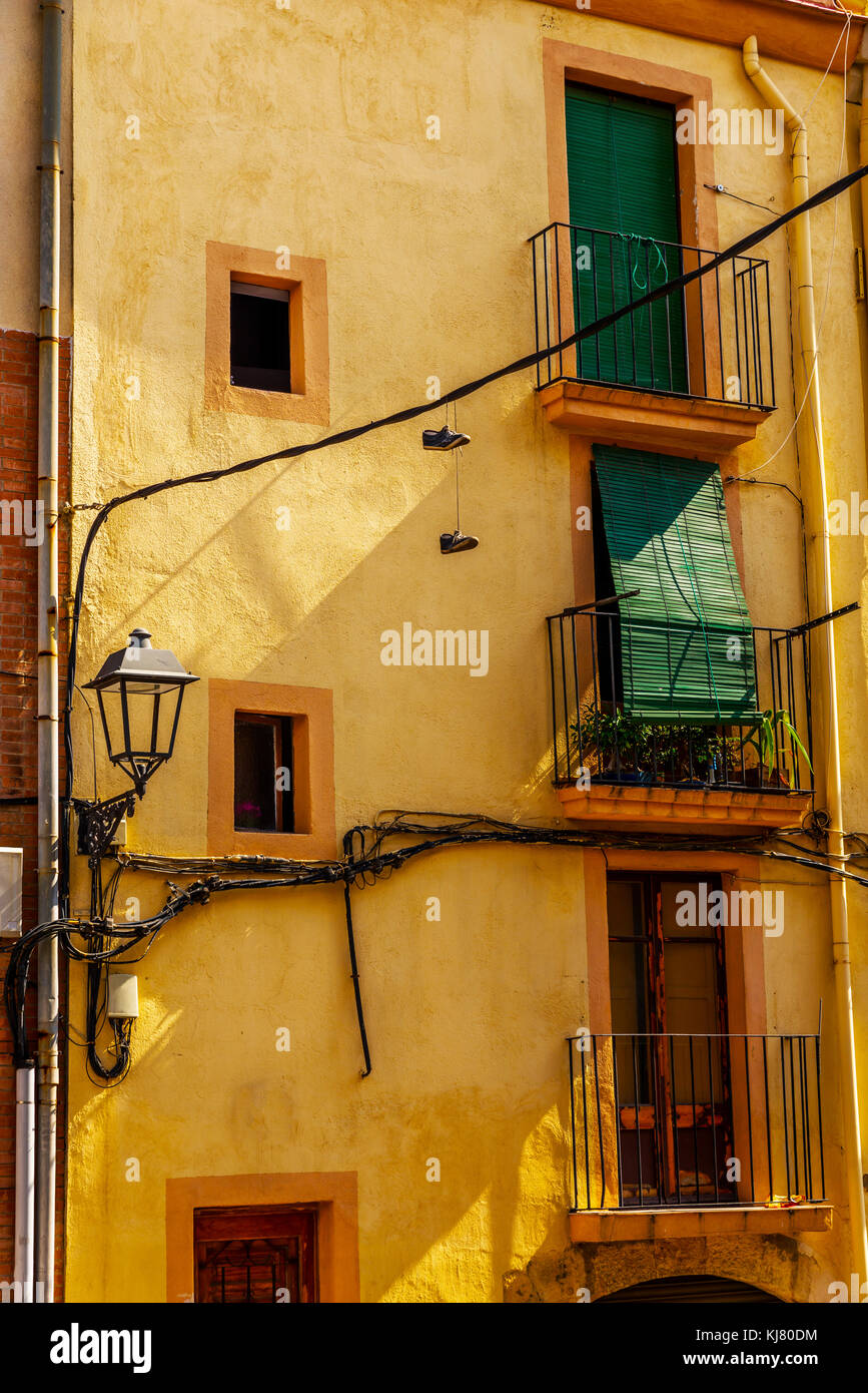 Stylish balcony with a metal railing, solid architectural element, a ...