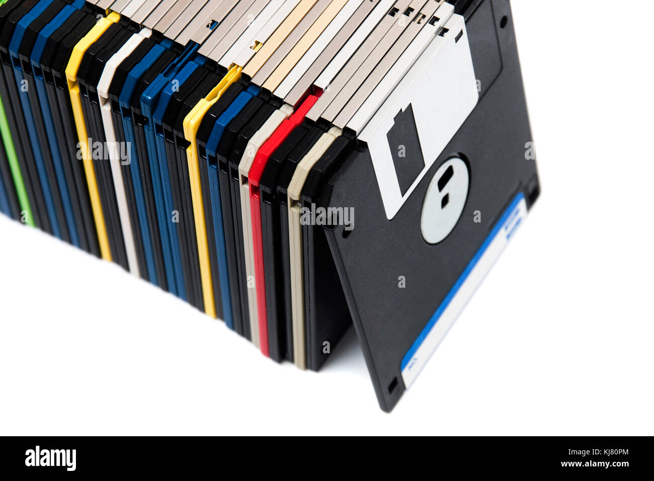 horizontal row of computer floppy disks isolated on a white background ...
