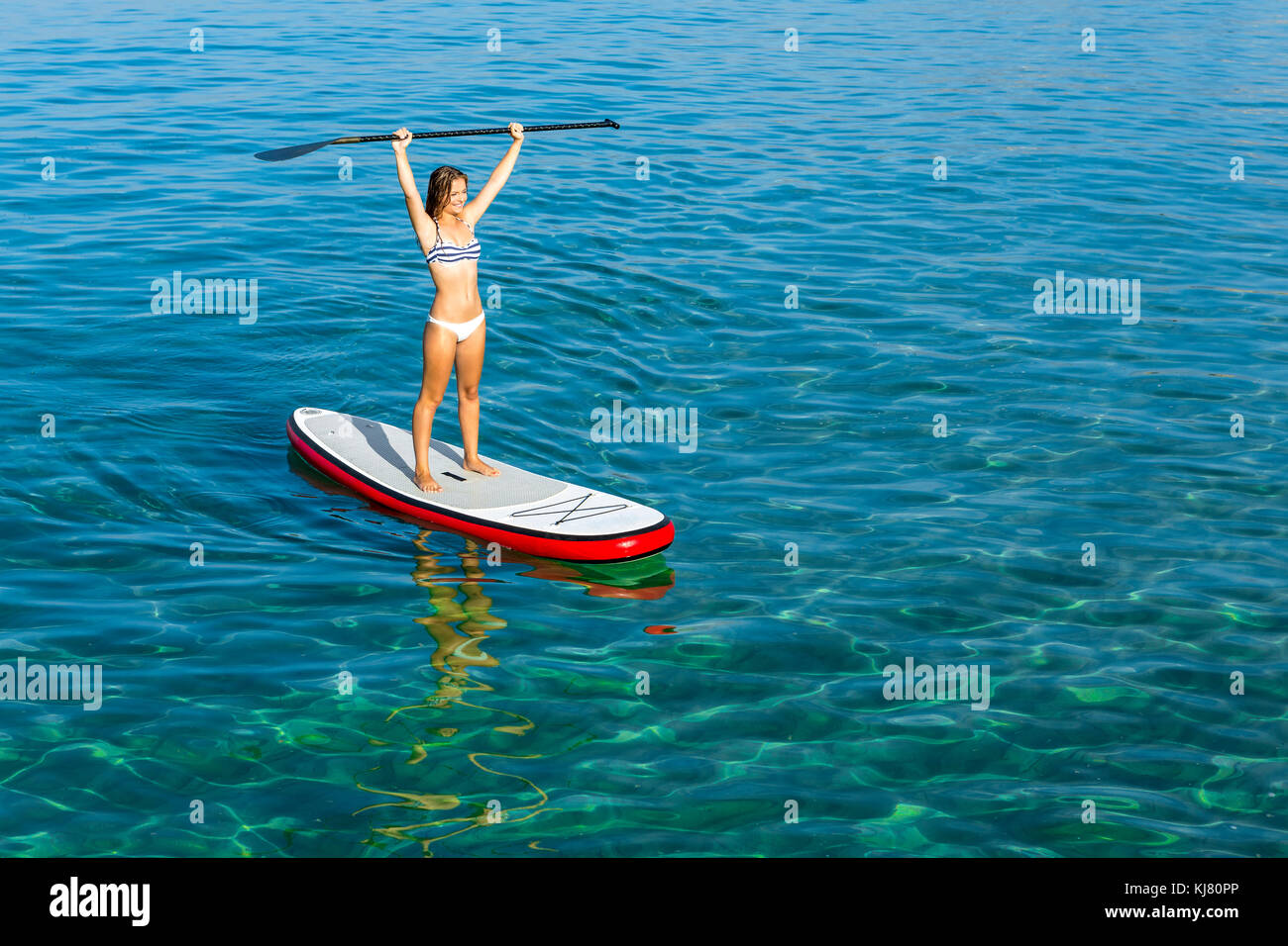 Surfer paddling with arms hi-res stock photography and images - Alamy