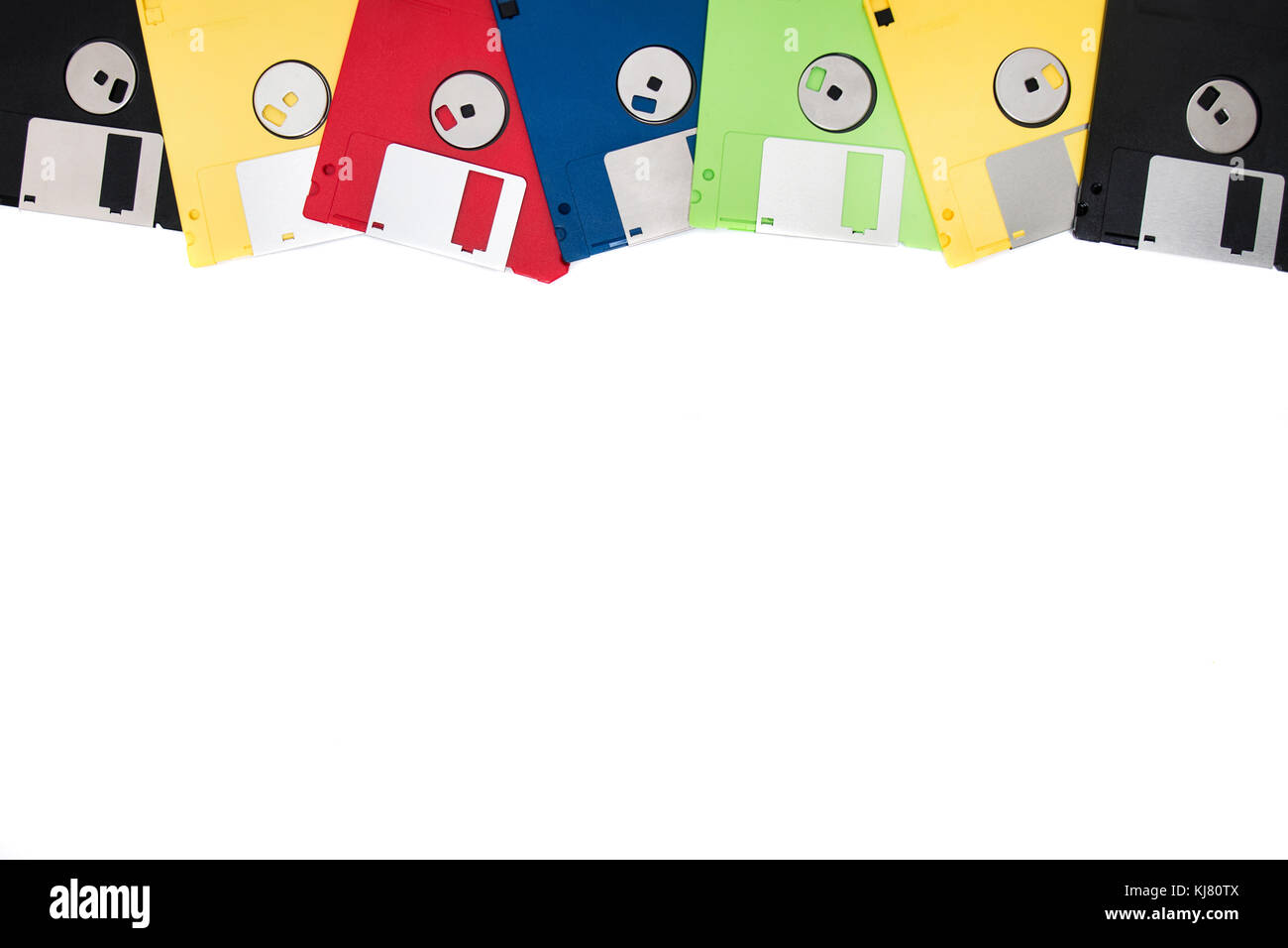 row of colorful computer floppy disks isolated on a white background ...