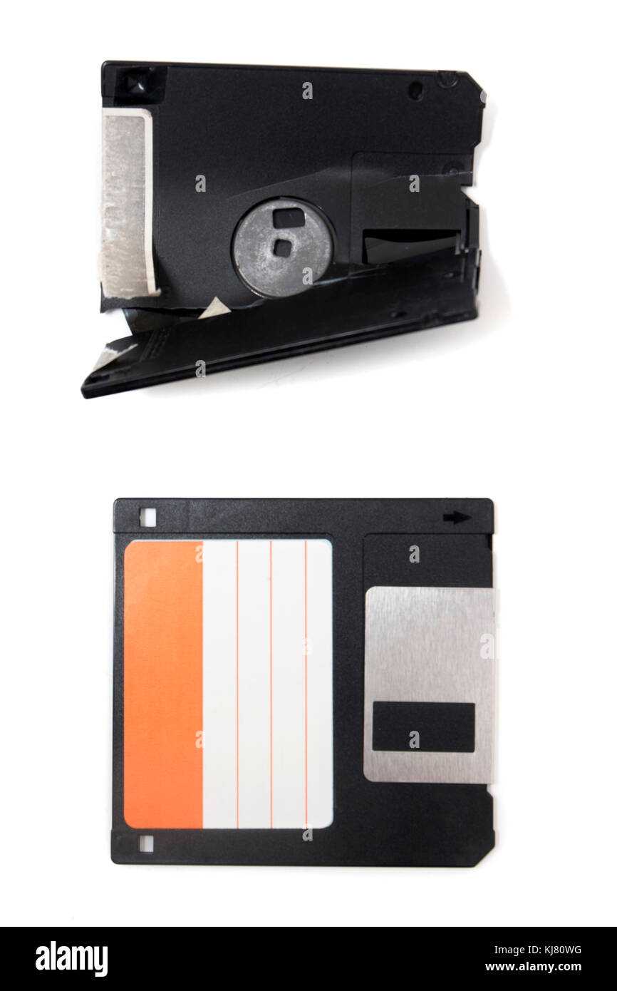 computer floppy disks, one broken and a new one, isolated on a white ...