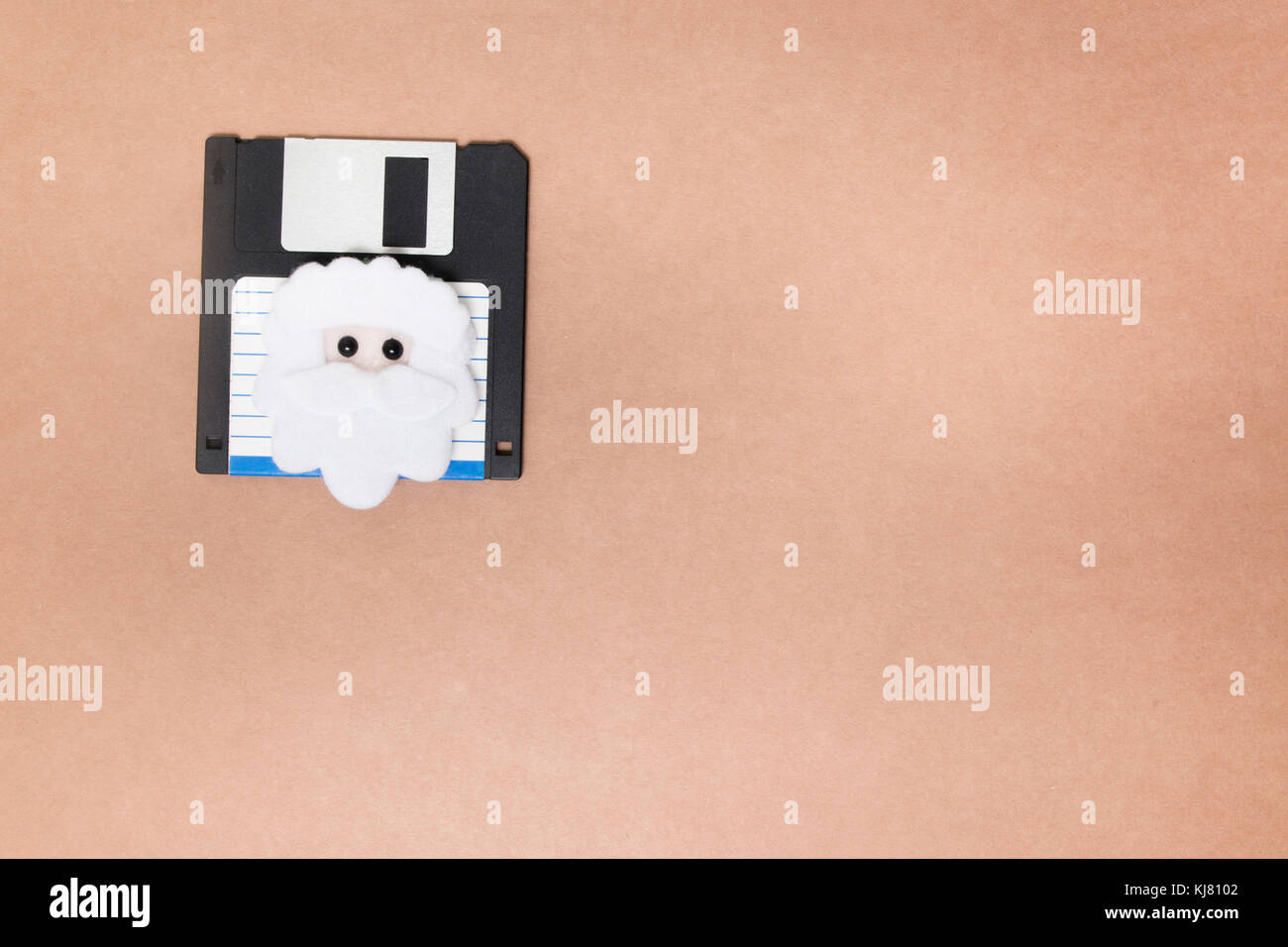 old floppy disk concept isolated on a brown background Stock Photo - Alamy