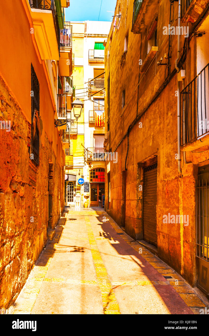 charming narrow street, street with colorful facades of buildings ...