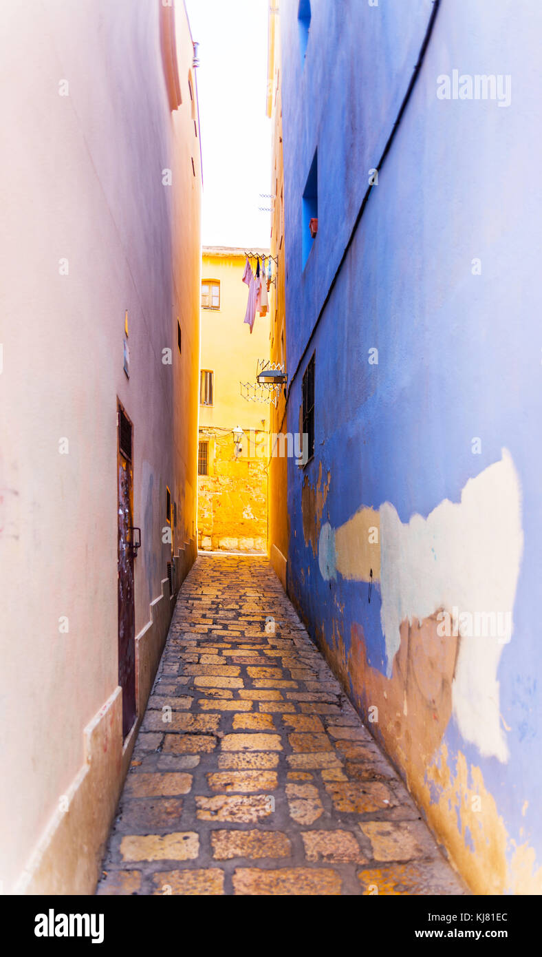 charming narrow street, street with colorful facades of buildings ...