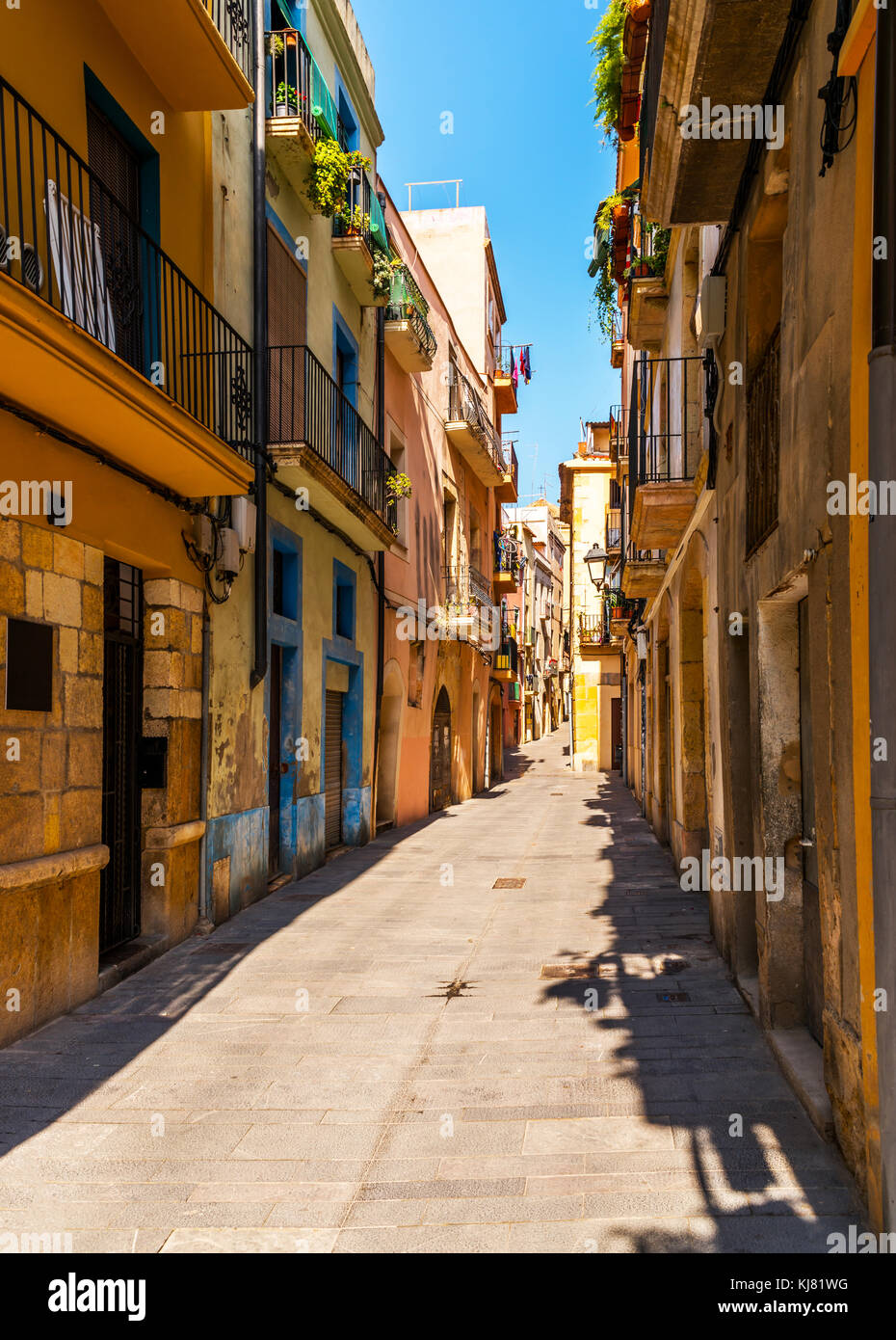 charming narrow street, street with colorful facades of buildings ...