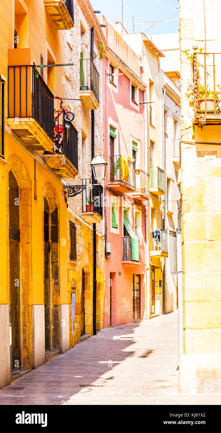 charming narrow street, street with colorful facades of buildings ...