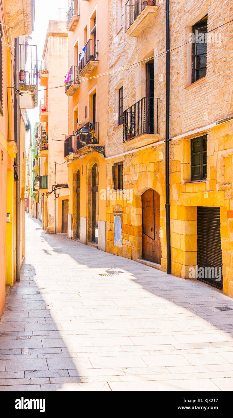 charming narrow street, street with colorful facades of buildings ...