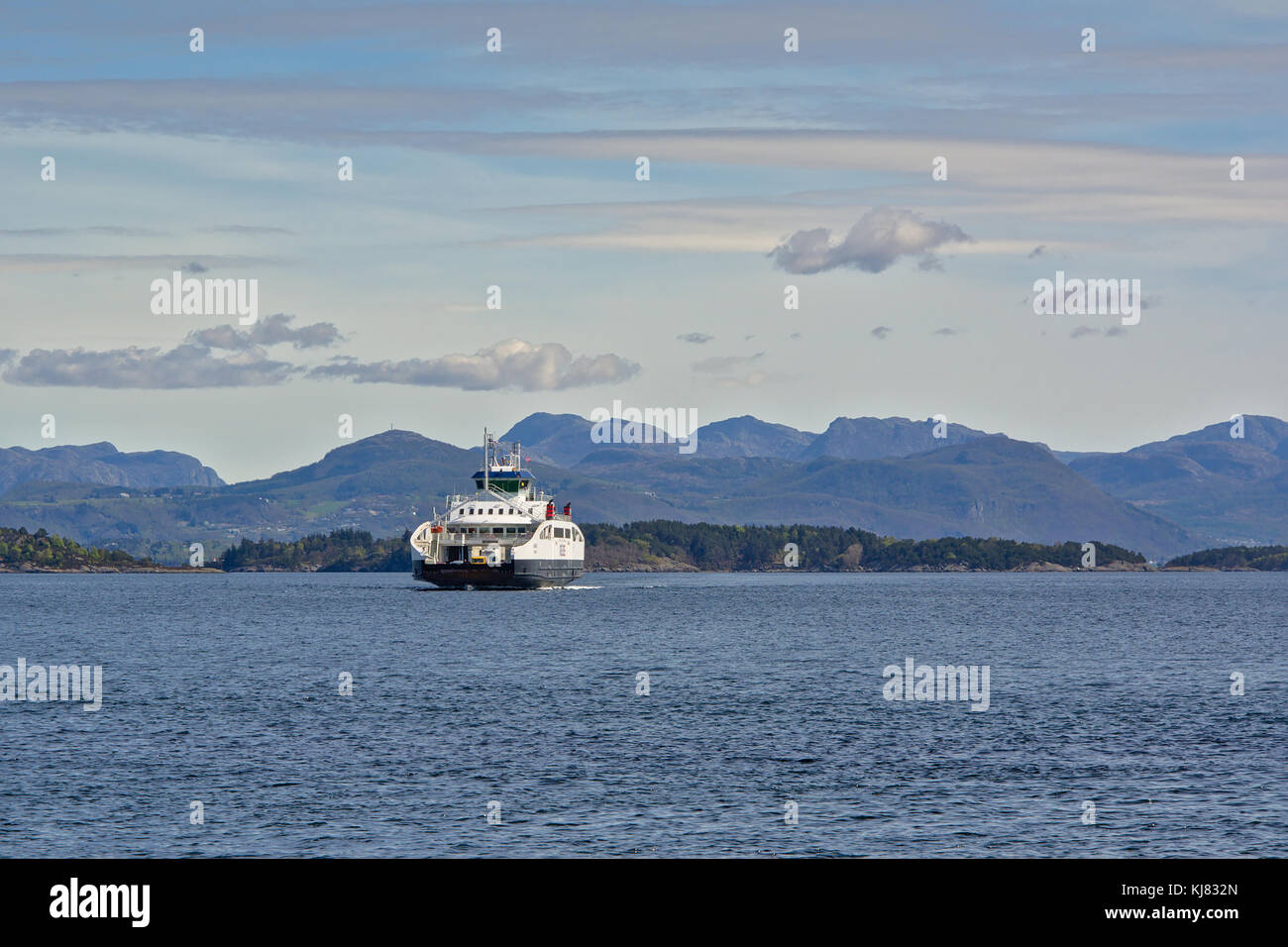 Ferry boat in a Norwegian fjord with mountains in the background Stock ...