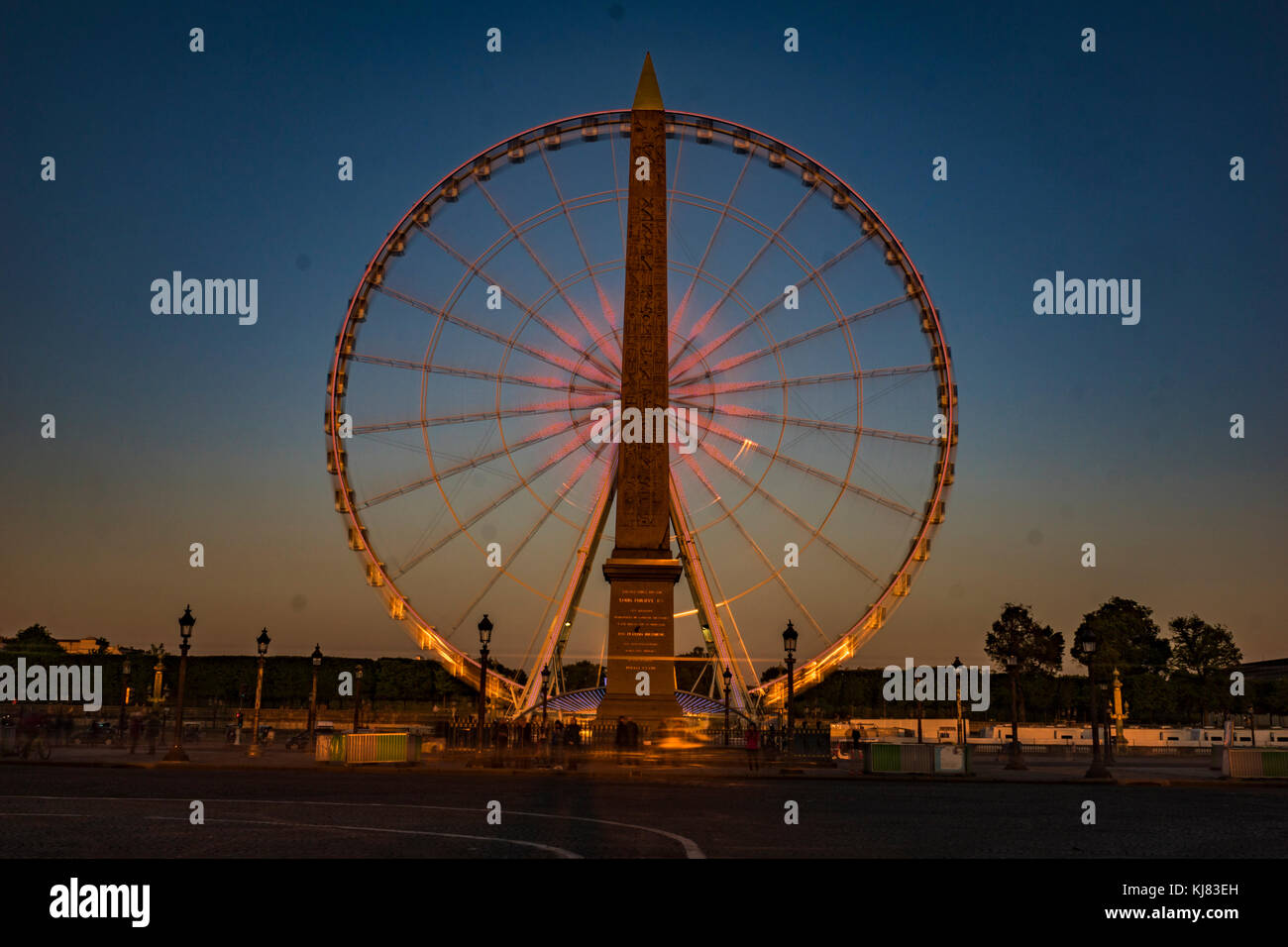 Paris, France. A Ferris Wheel at dusk at the Place de la Concorde, near ...