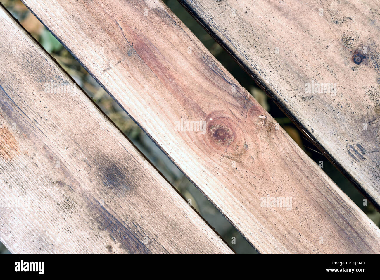 Naturally aged wooden planks in a diagonal format with grains of wood ...