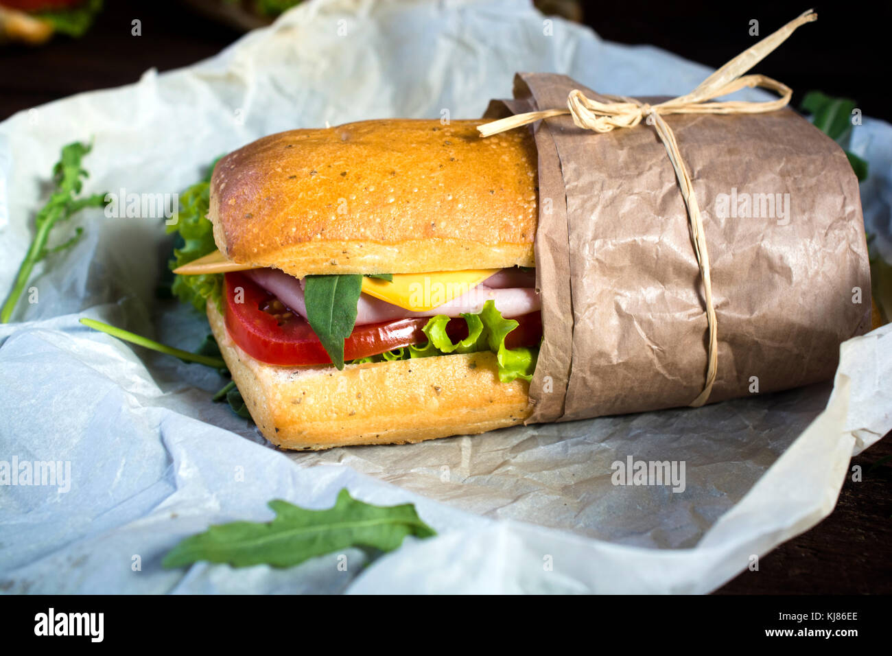 Panini sandwich packed in the paper,selective focus Stock Photo - Alamy