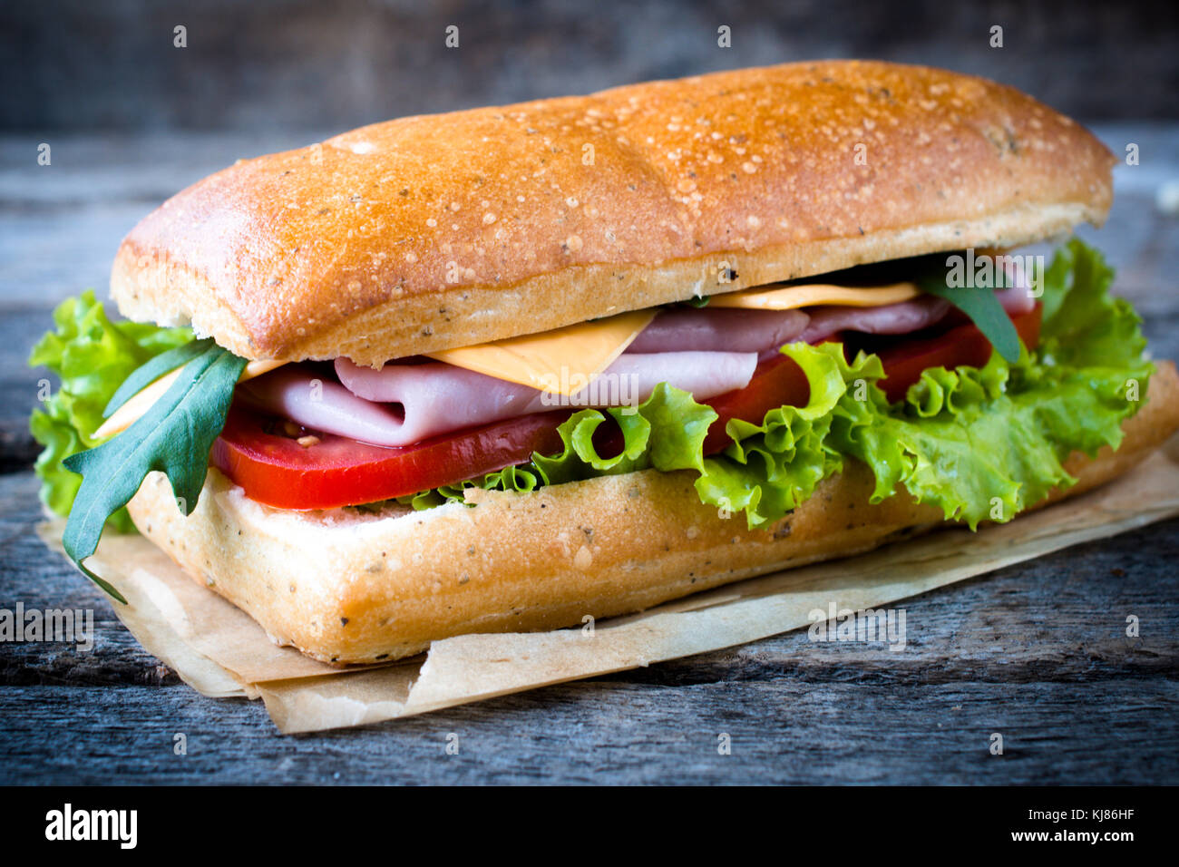 Popular Italian panini sandwich with ham on wooden background,selective ...