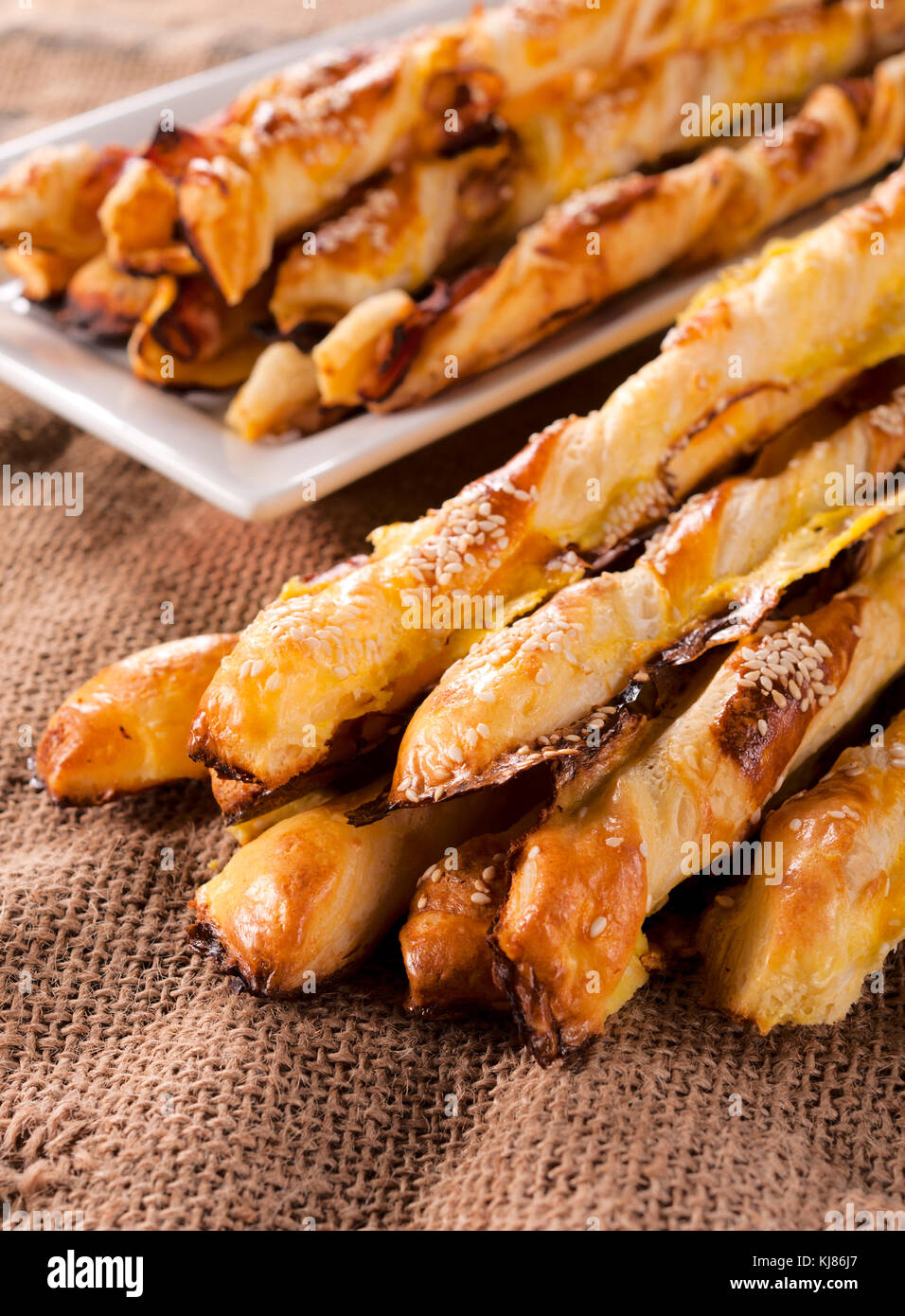 Puffed pastry with cheese and sesame Stock Photo - Alamy