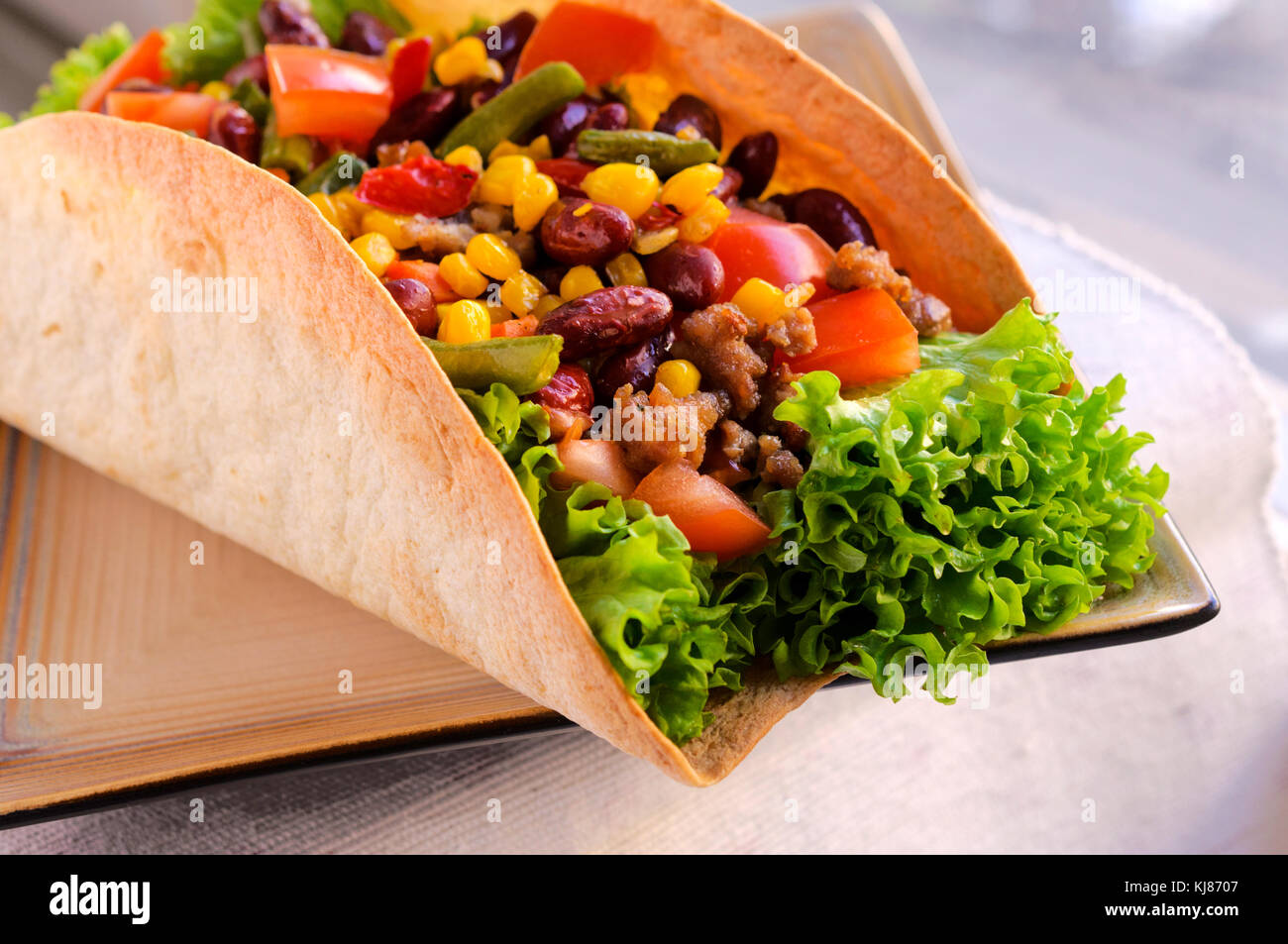 Selective focus on the front side of taco sandwich Stock Photo - Alamy