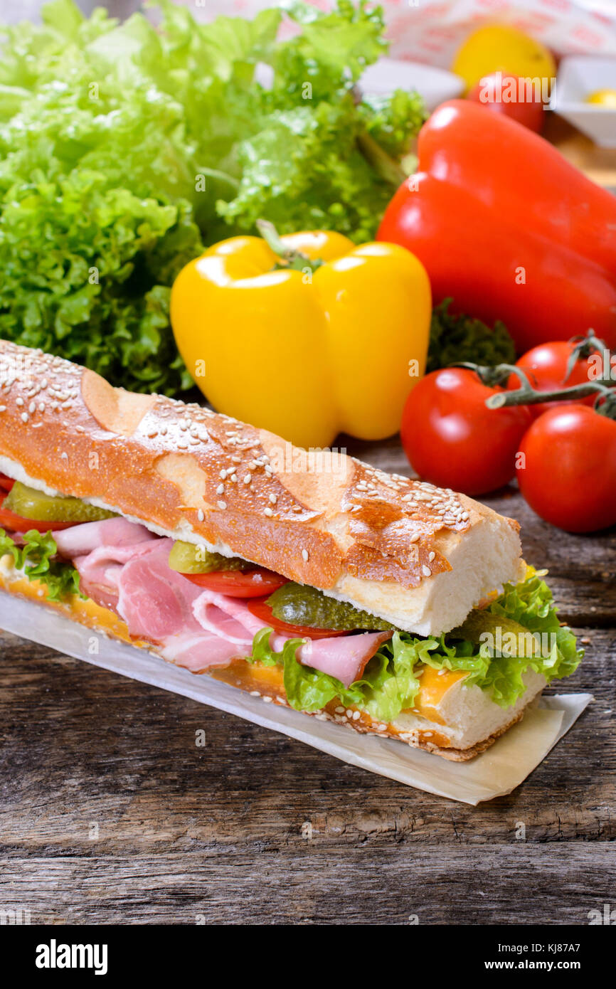 Submarine sandwich with vegetables and prosciutto,selctive focus Stock ...